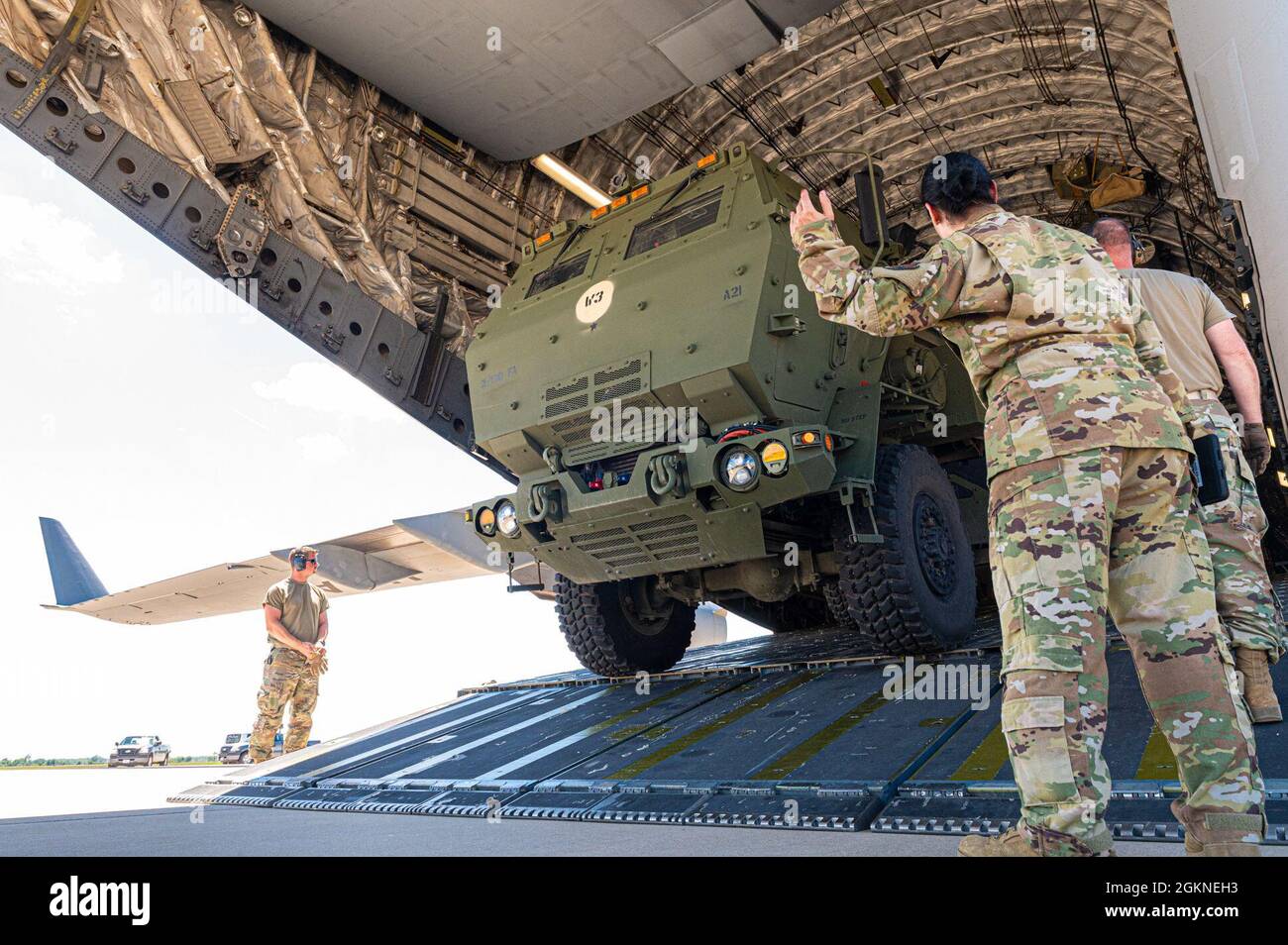 U.S. Airmen with the 105th Airlift Wing, New York National Guard, load ...