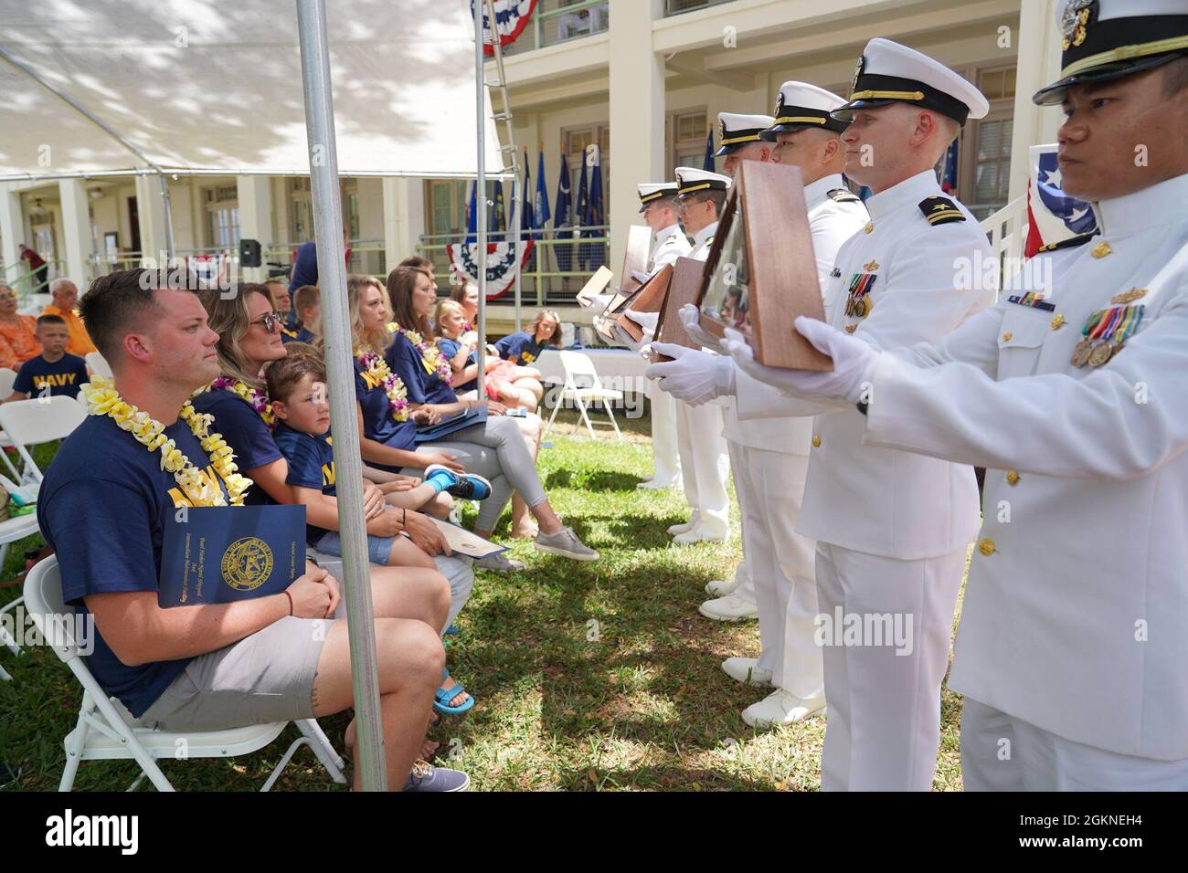 Sailors from Pearl Harbor Naval Shipyard and IMF present flags that ...