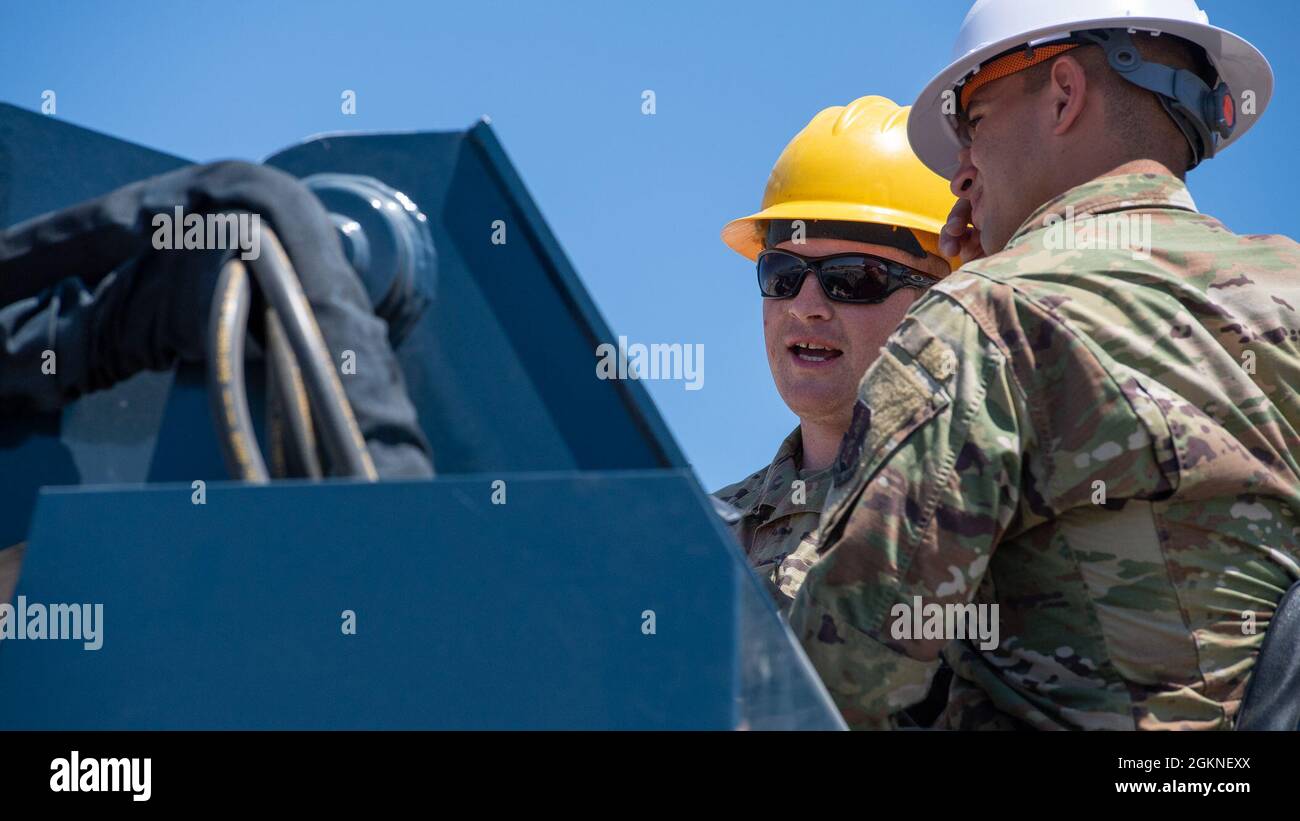 Tech. Sgt. Ian L. McCleod, an electrical systems craftsman, explains ...