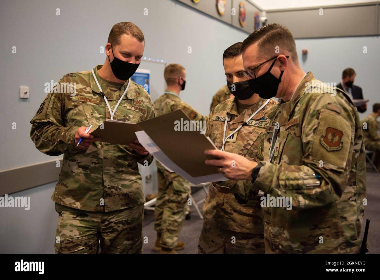 U.S. Air Force Chief Master Sgt. Michael Venning, left, 422nd Air Base ...