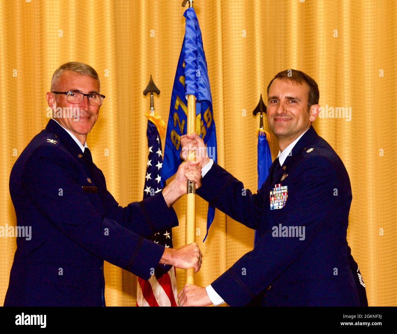 Col. James Mach, 927th Operations Group Commander passes the 927th ...