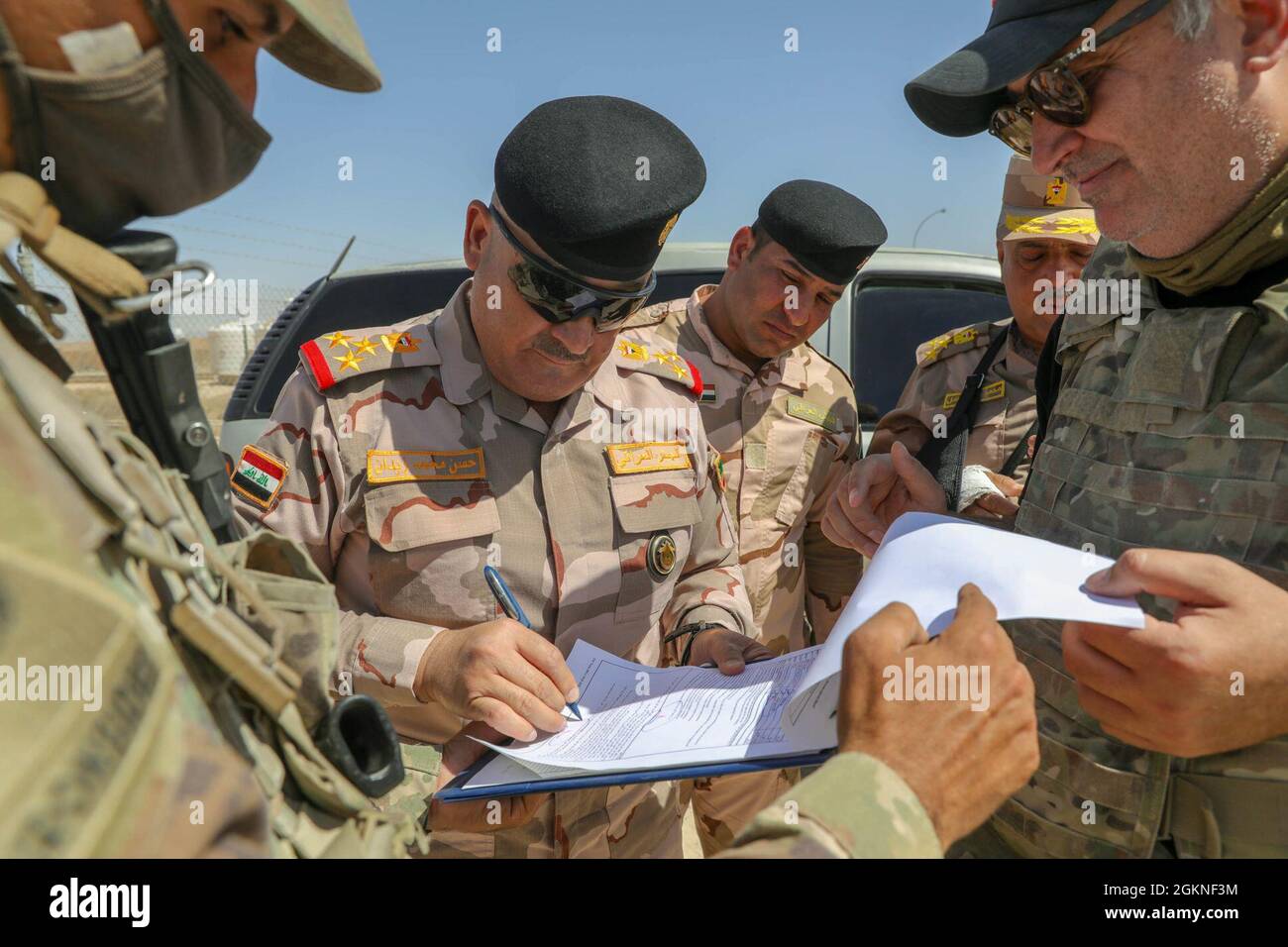 U.S. Army Officer 2LT Rudolph DaRocha reviews the inventory with Iraqi ...