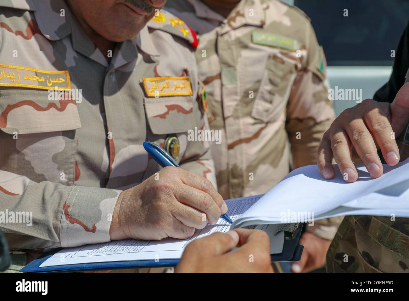 Iraqi Brigadier General signs for vehicles, Counter-ISIS Train and ...