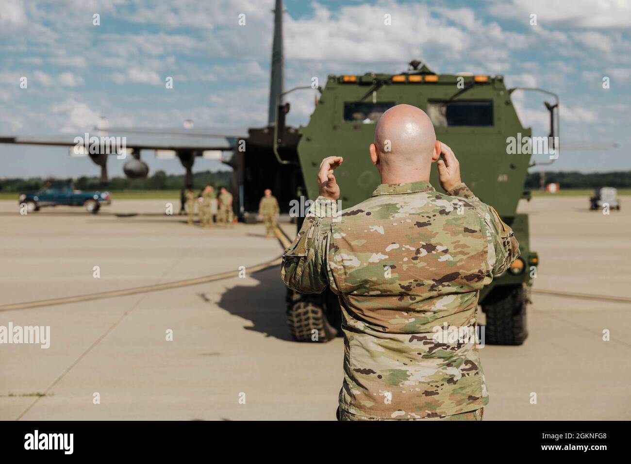 U.S. National Guard service members prepare to load an M142 High ...