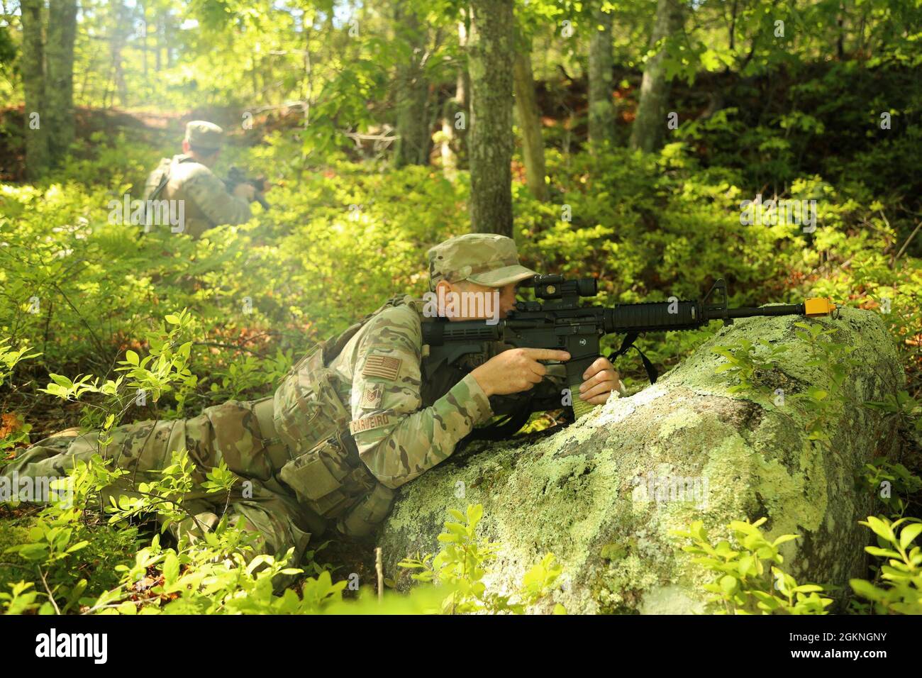 Tech. Sgt. Joel Carveiro, 102nd Security Forces Squadron, takes up a ...