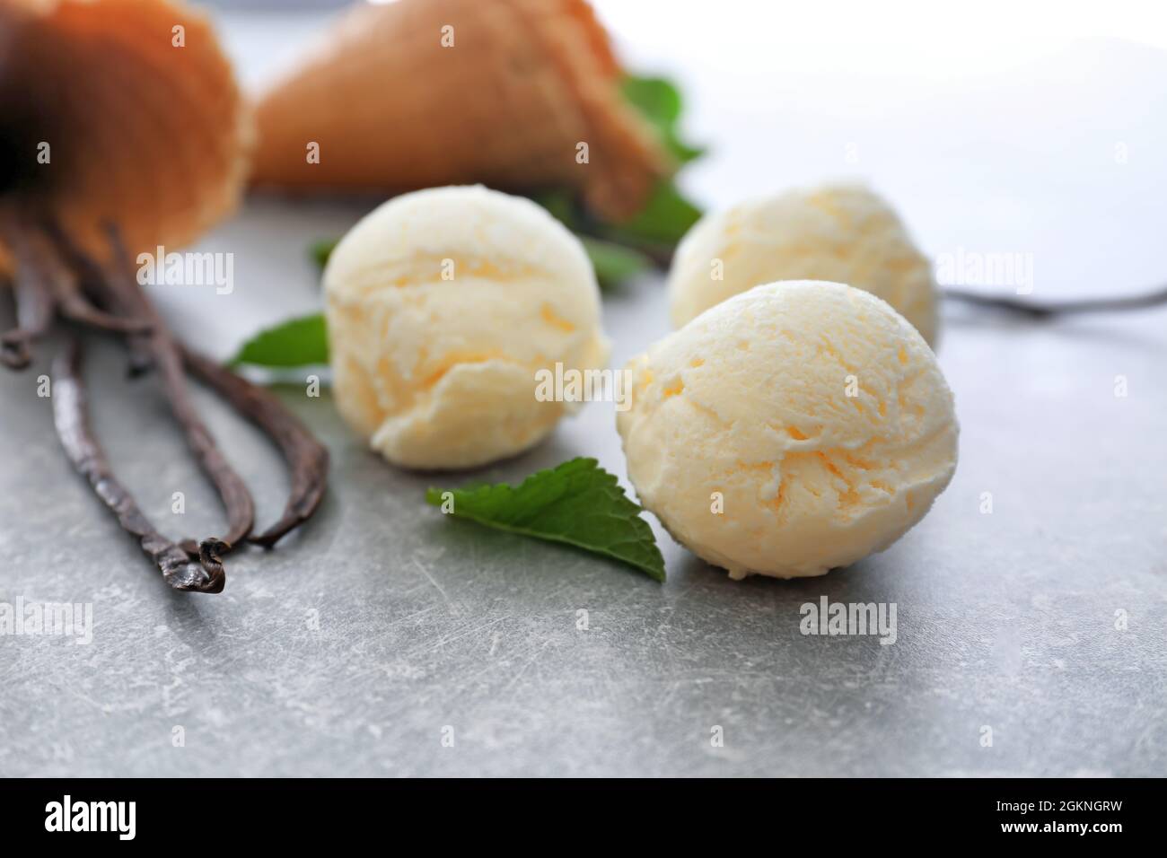 Yummy vanilla ice cream balls on grey background Stock Photo - Alamy