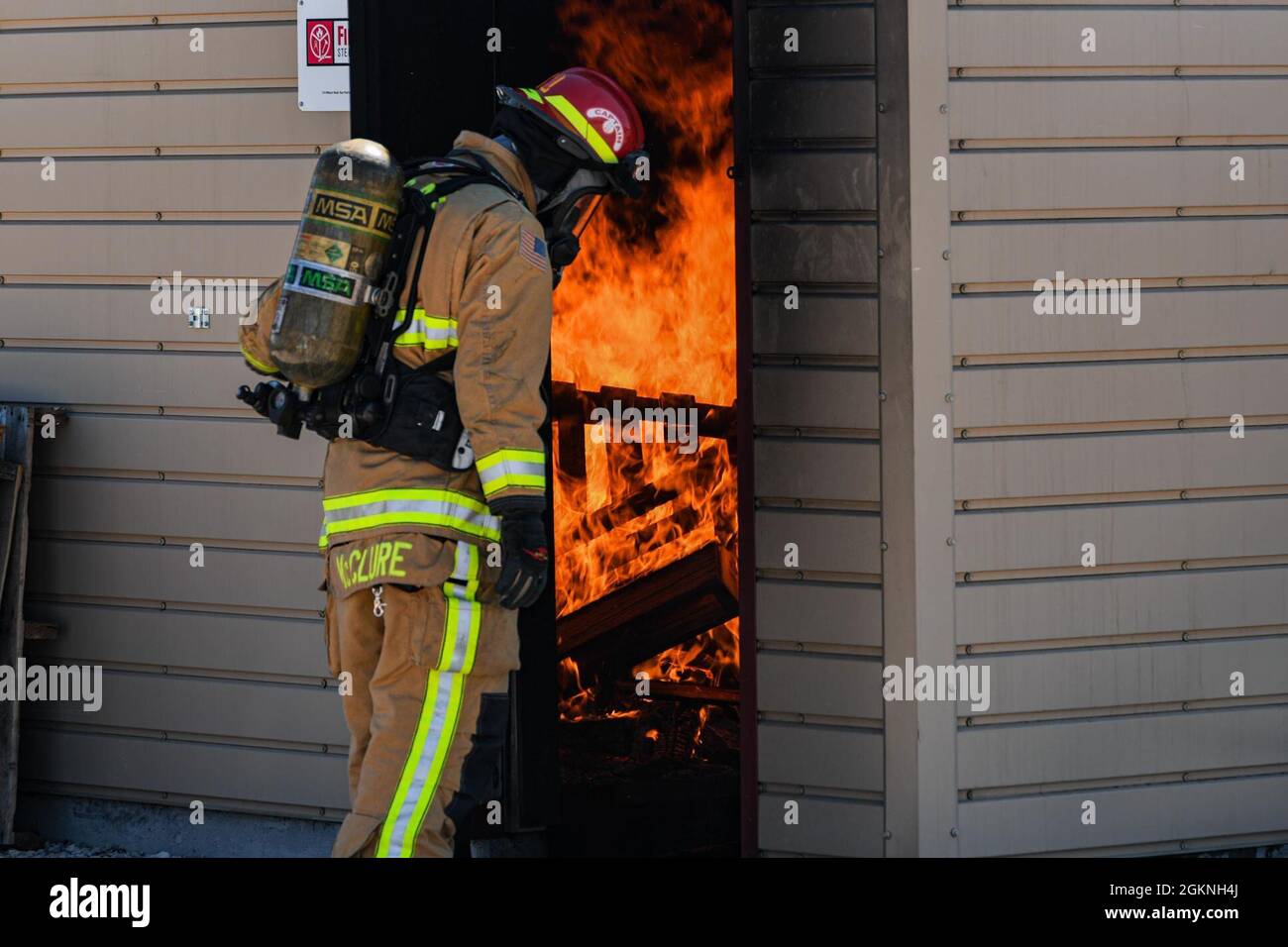 A firefighter assigned to the 90th Civil Engineer Squadron enters a ...