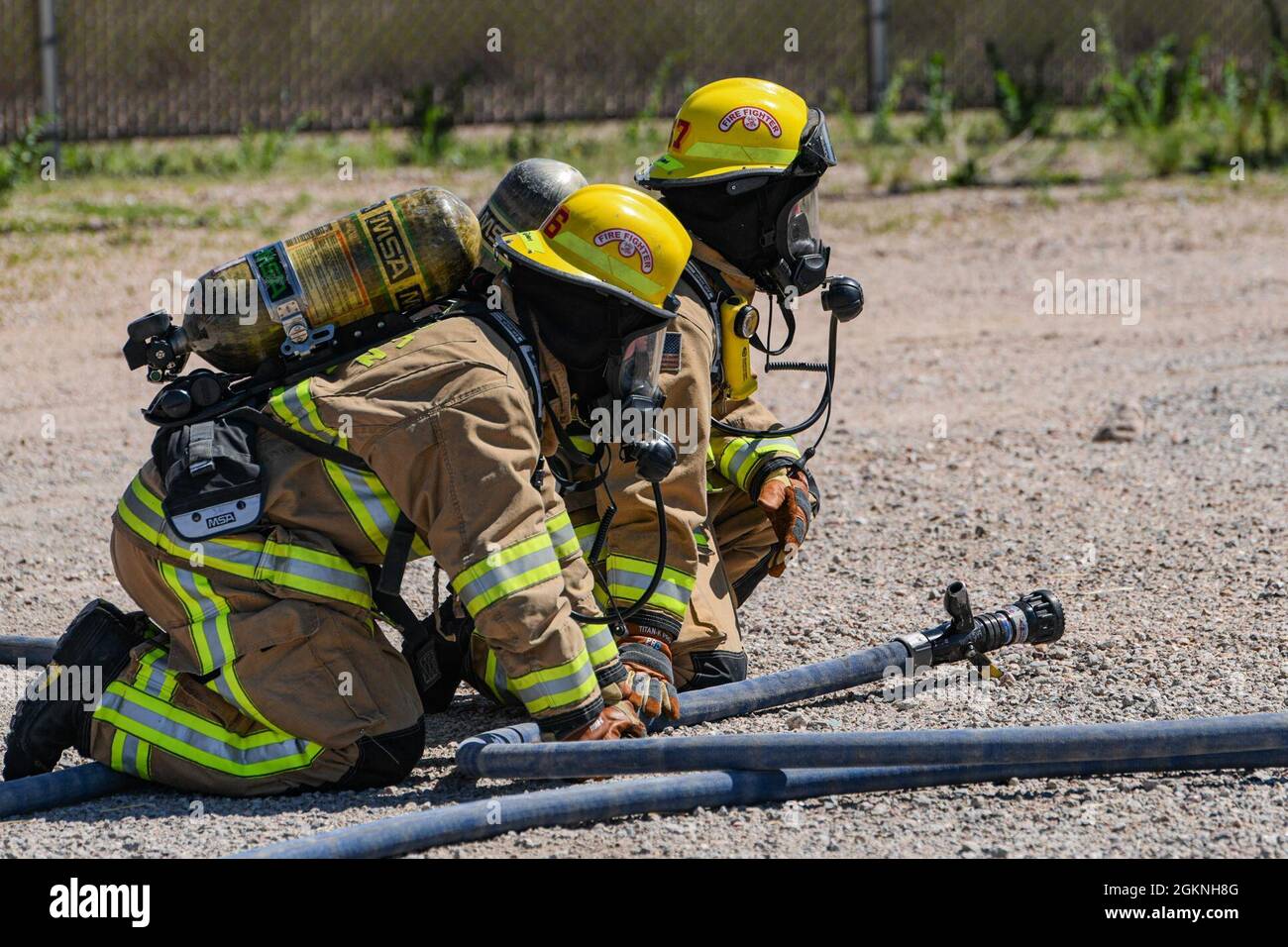 Firefighters assigned to the 90th Civil Engineer Squadron monitor the ...