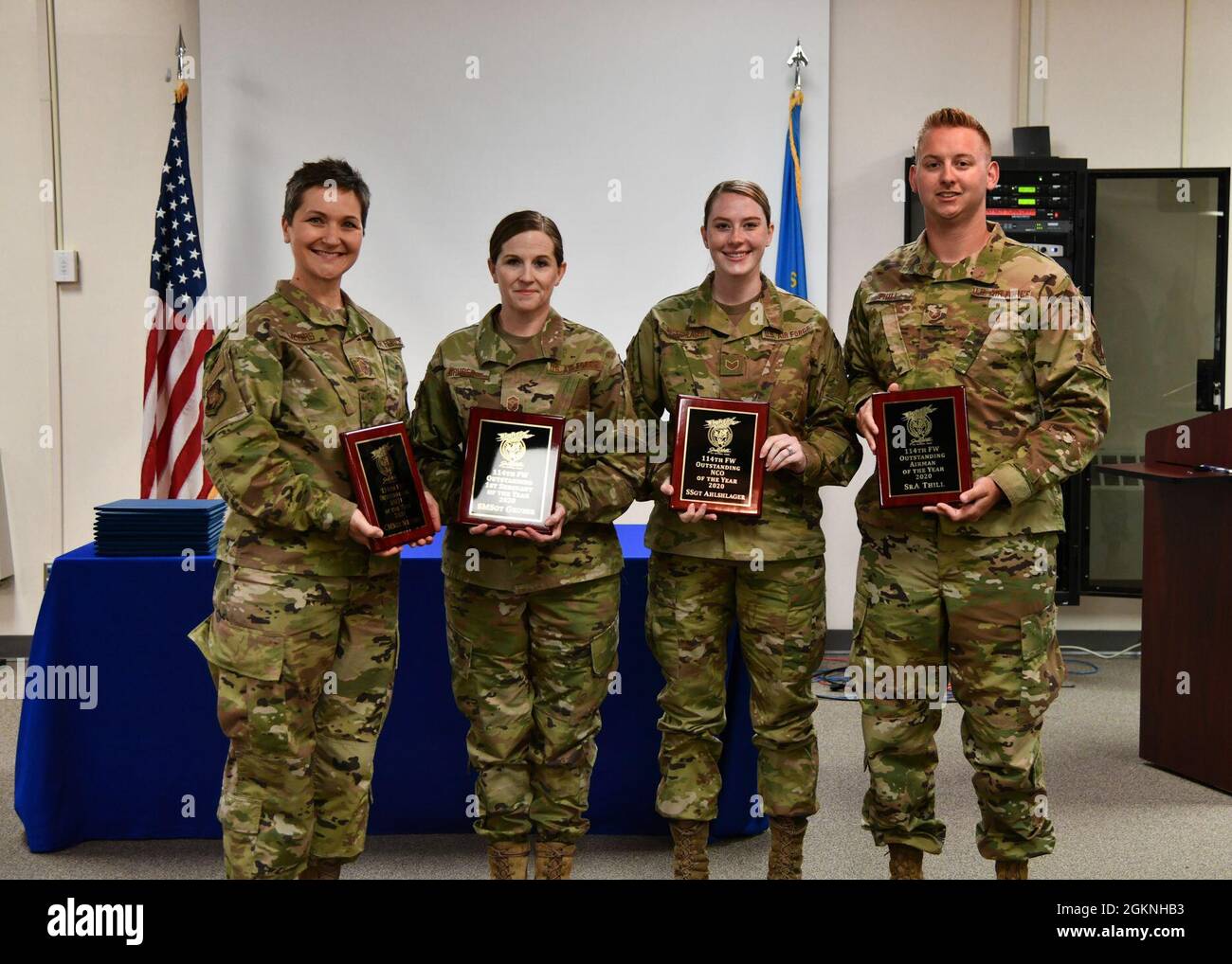 Members of the 114th Fighter Wing pose for a group photo with their ...