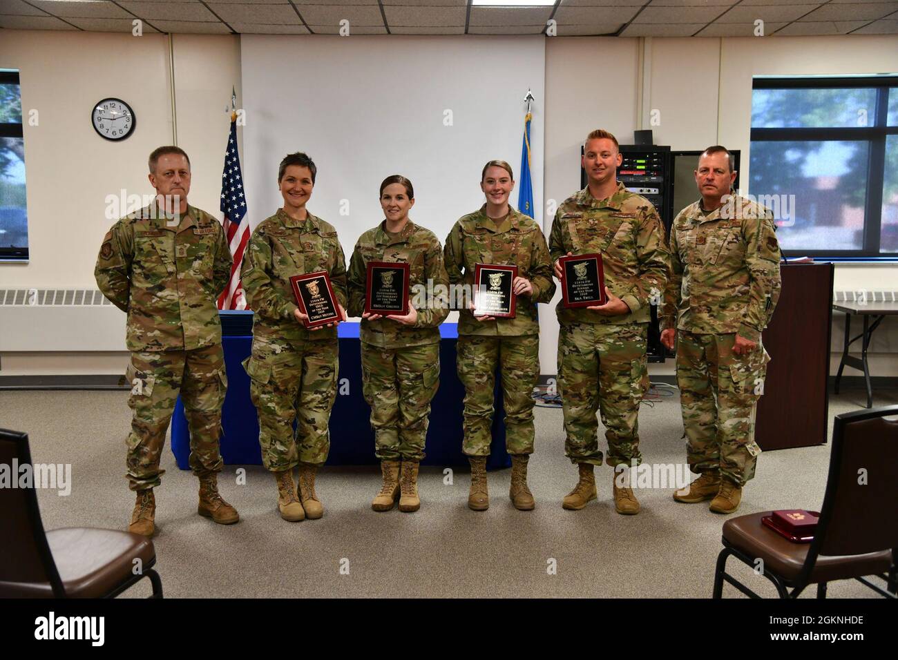 Members of the 114th Fighter Wing pose for a group photo with their ...