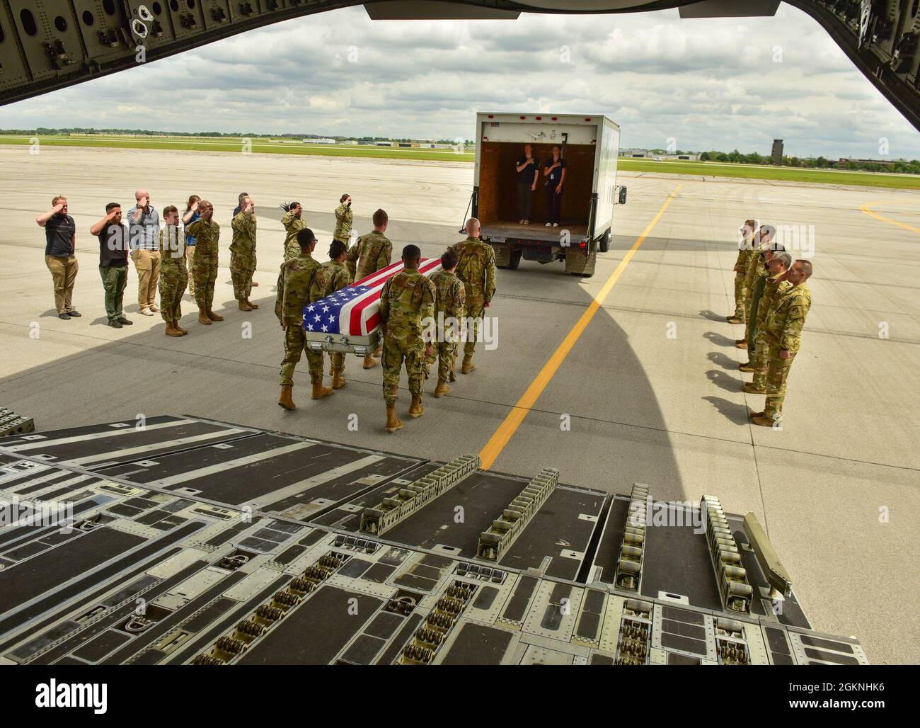 Members of the Defense POW/MIA Accounting Agency (DPAA) along with base ...