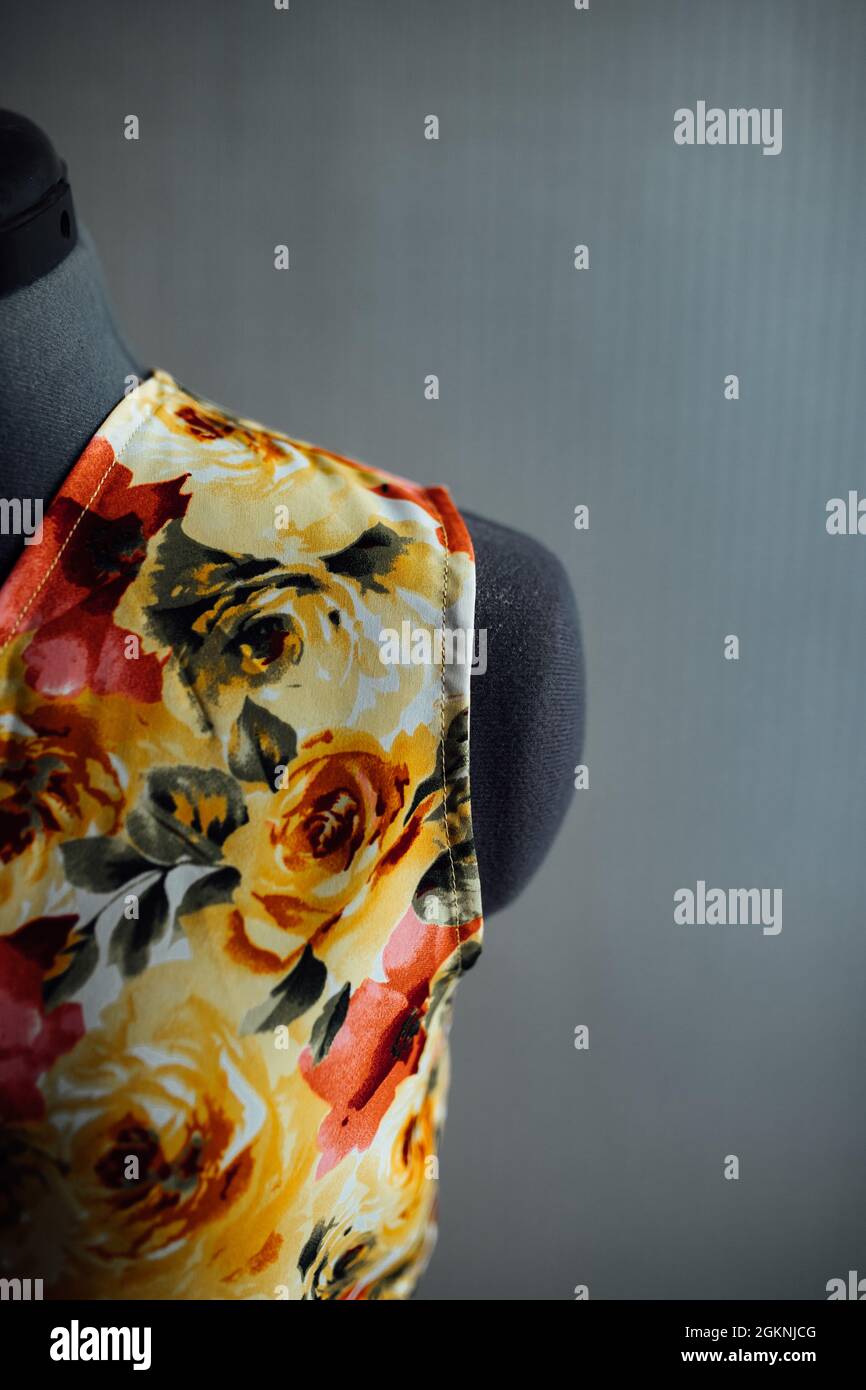 yellow-red dress made of natural fabric on a mannequin. photo of ...
