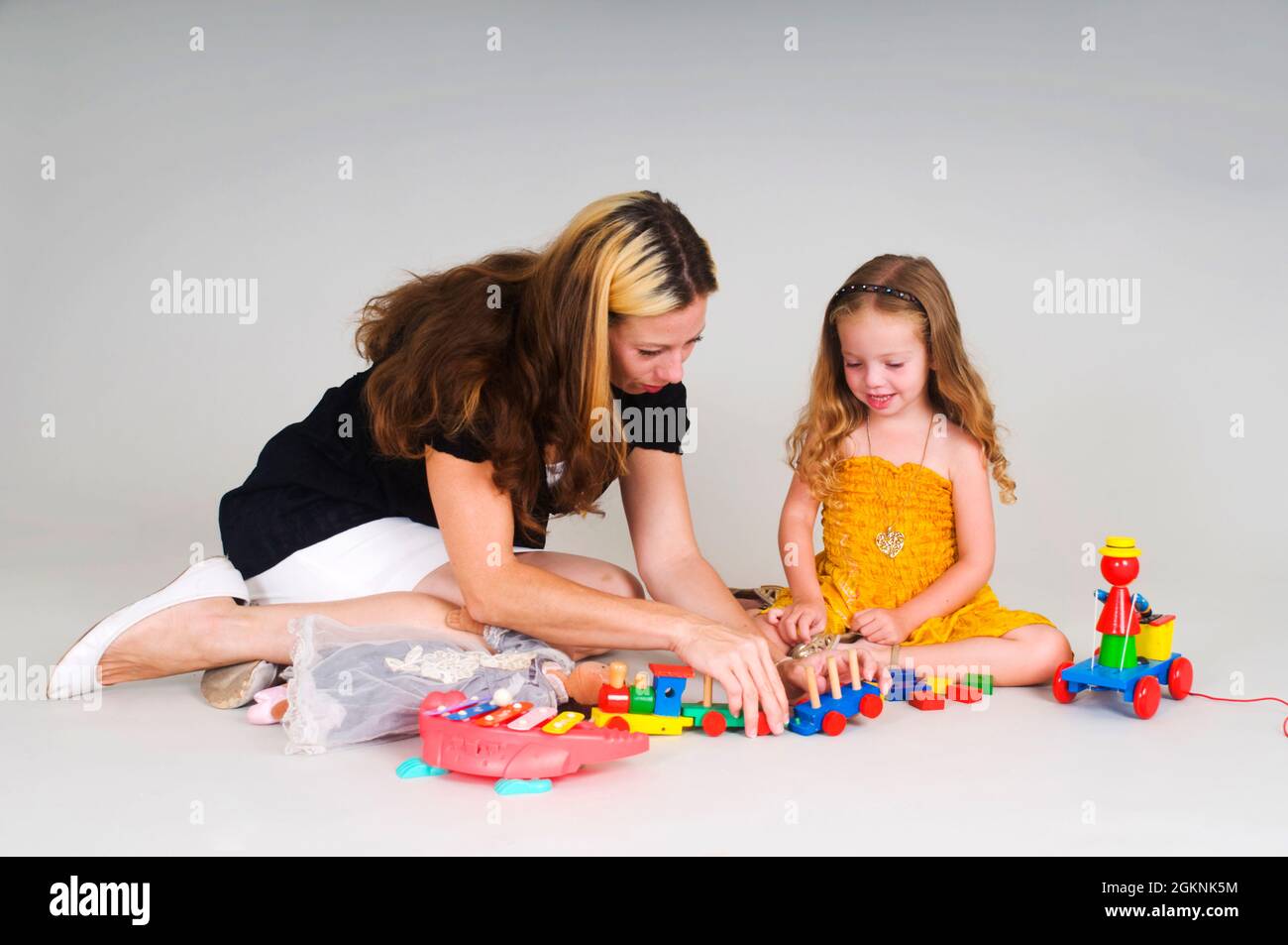 Mother daughter playing building blocks hi-res stock photography and images - Alamy