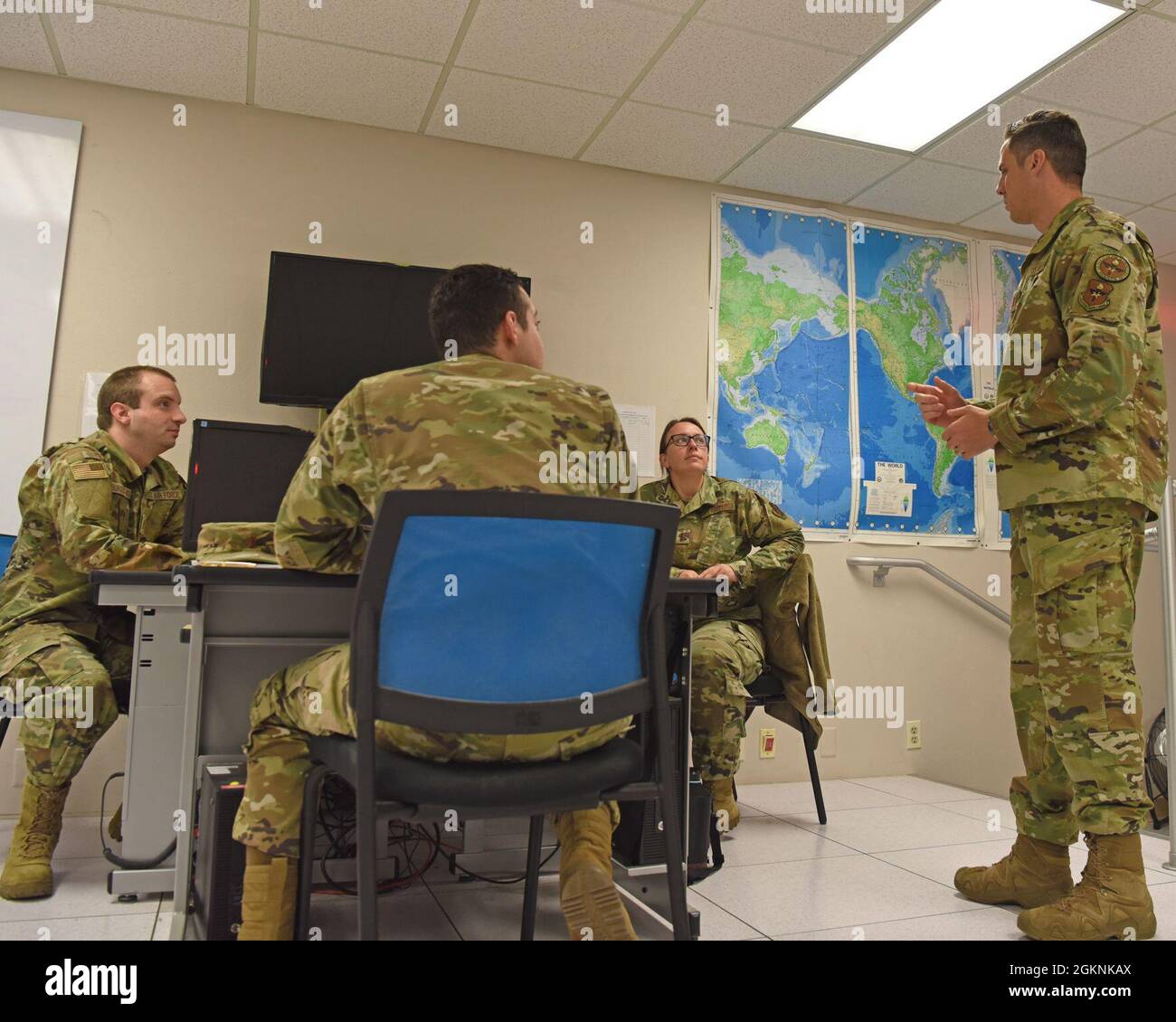 U.S. Air Force Capt. Tyler Sumrall, 315th TRS instructor, talks with ...