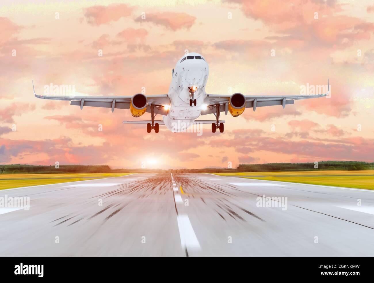 Large passenger plane take off from the runway before the light from ...