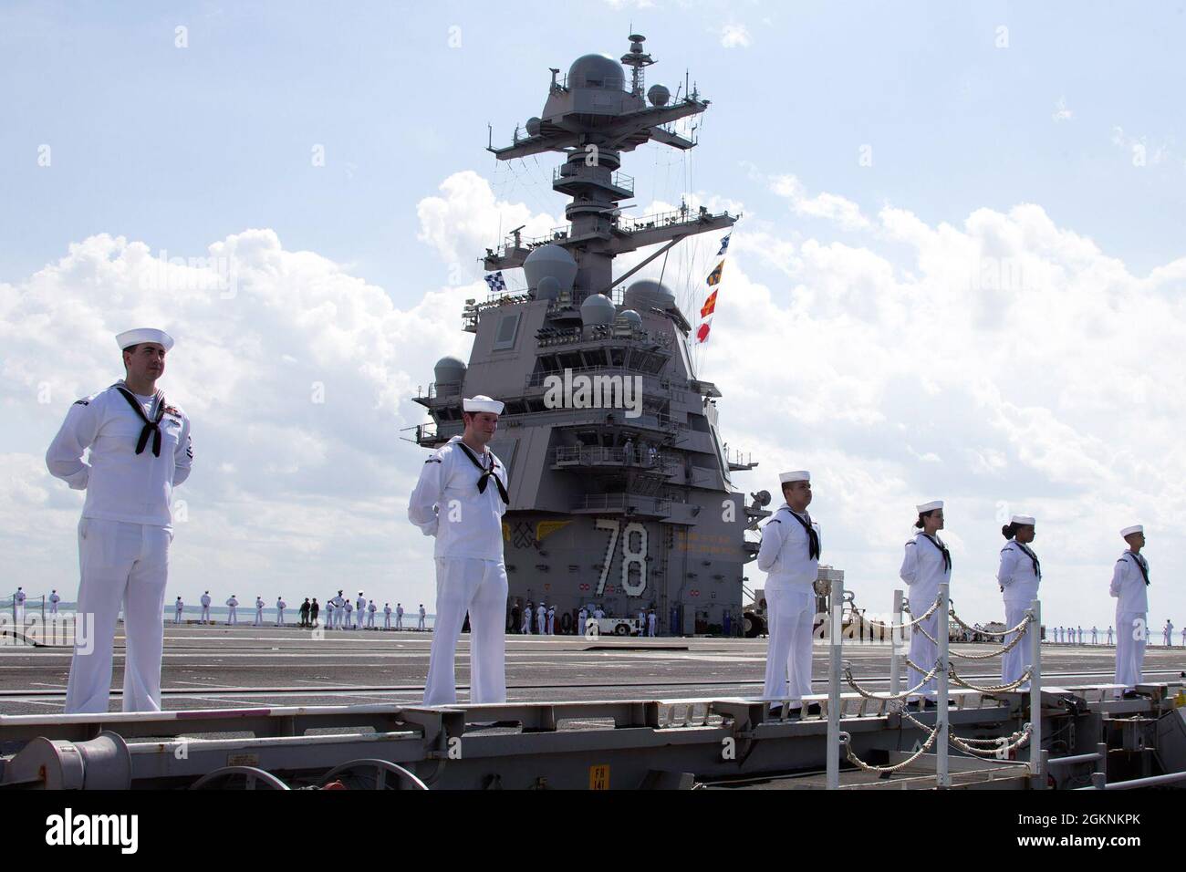 Sailors assigned to USS Gerald R. Ford (CVN 78) man the rails in honor ...