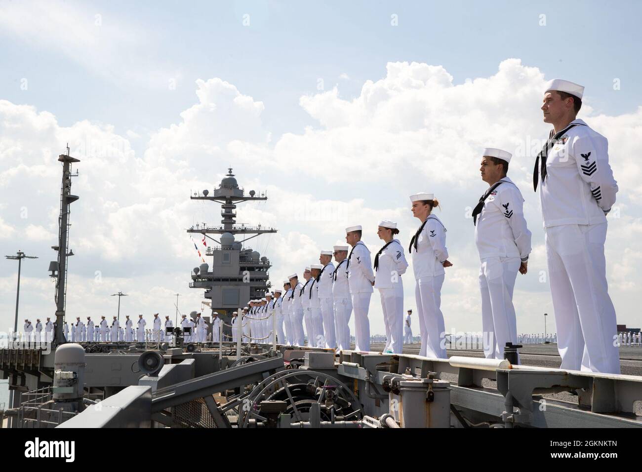 Sailors assigned to USS Gerald R. Ford (CVN 78) man the rails in honor ...