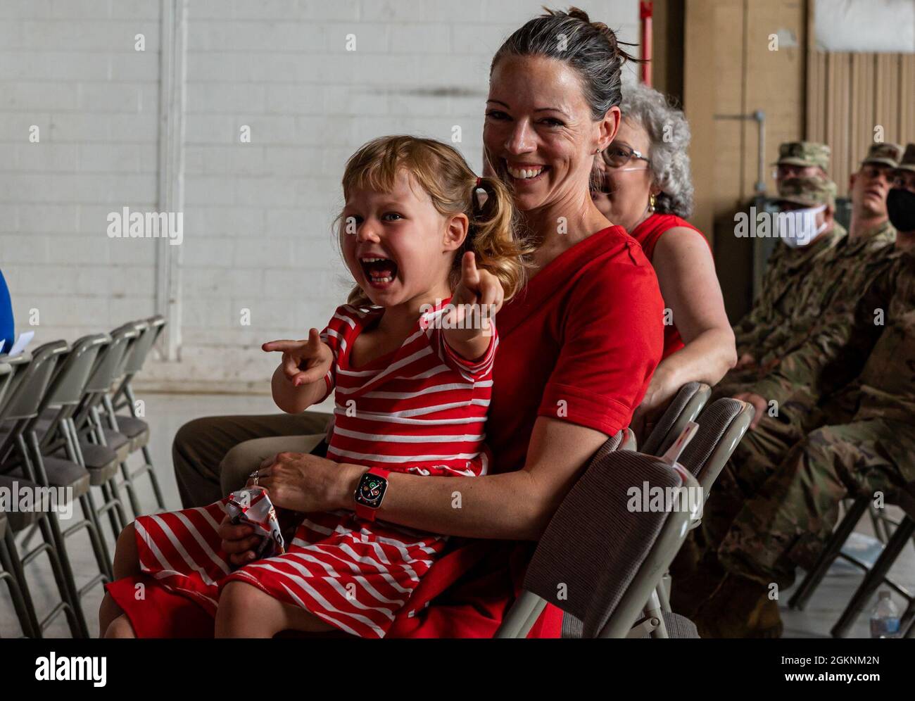 Family of United States Airmen during a change of command ceremony for ...