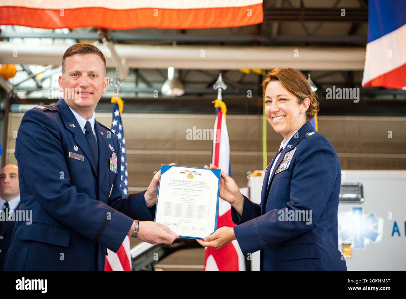 U.S. Air Force Col. Richard Martin, left, 423rd Air Base Group commander, presents a Meritorious ...