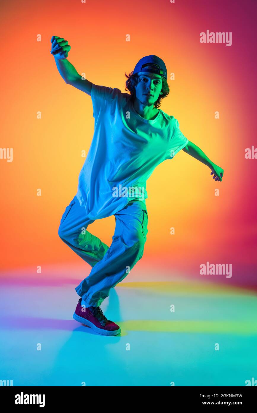 Close-up portrait of young man, hip-hop dancer in stylish clothes in ...