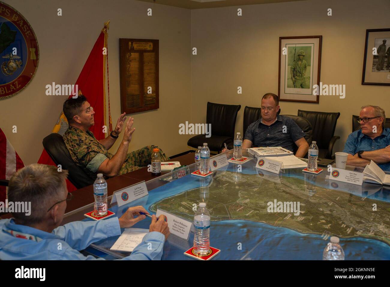 Lt. Col. Tate Buntz, the Marine Corps Base (MCB) Camp Blaz Operations Officer, briefs personnel ...