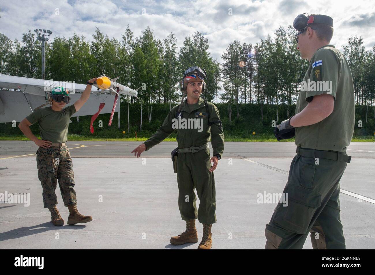 U.S. Marine Corps Lance Cpl. Samuel Setiadi, left, a native of Queens ...