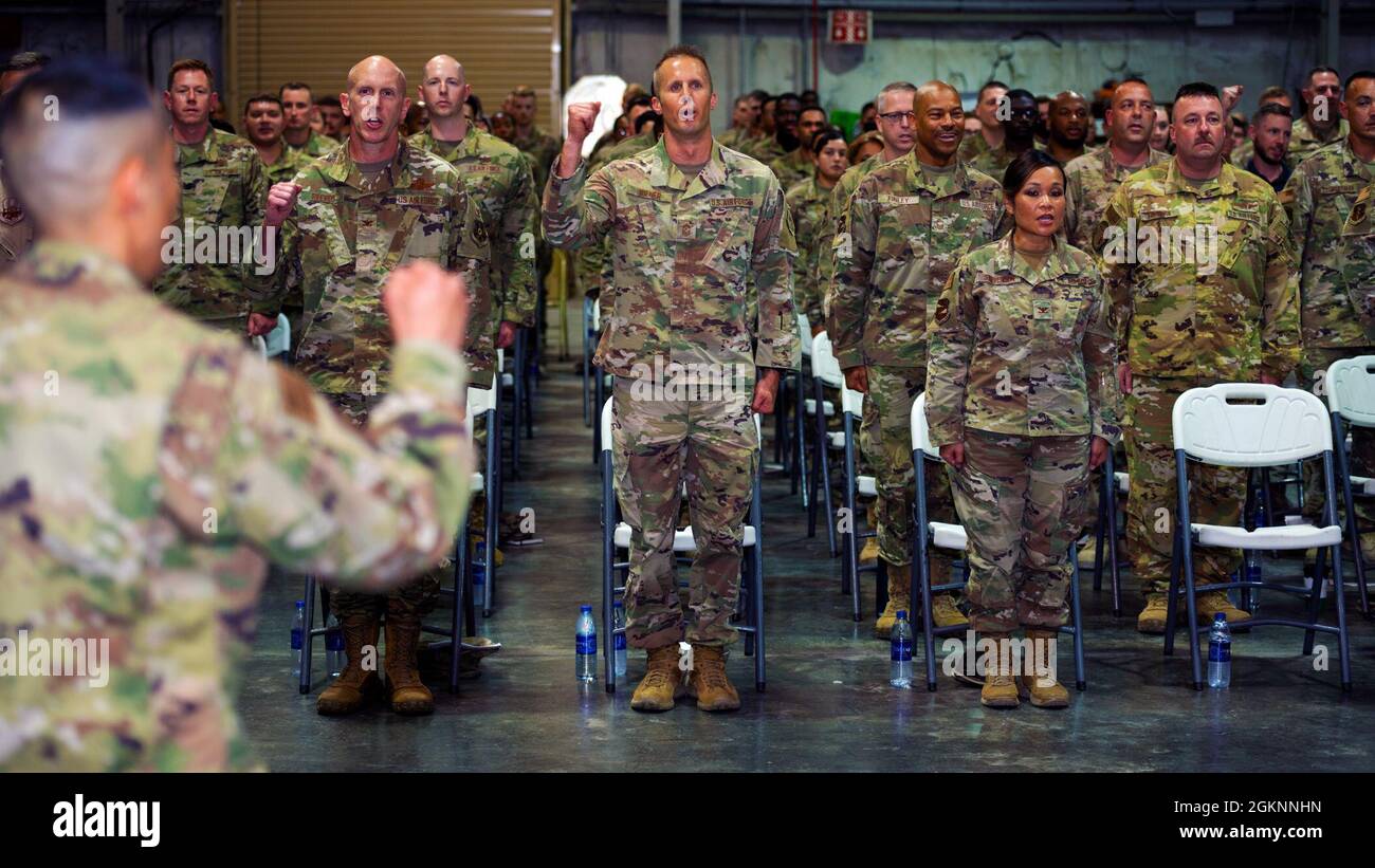 Attendees sing the Air Force Song at the end of a change of command ...