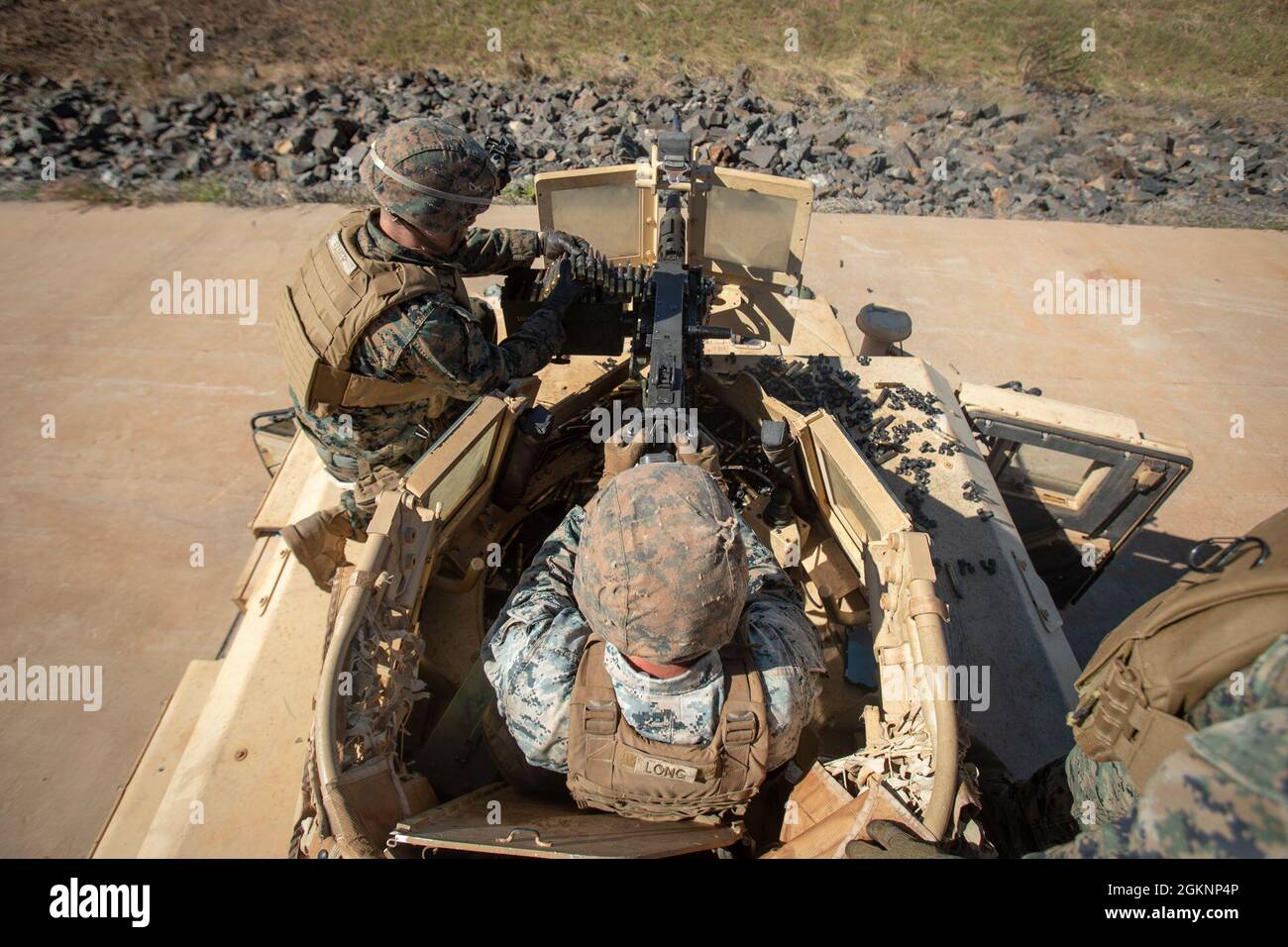 U.S. Marine Corps Lance Cpl. Austin Long, center, a motor vehicle ...