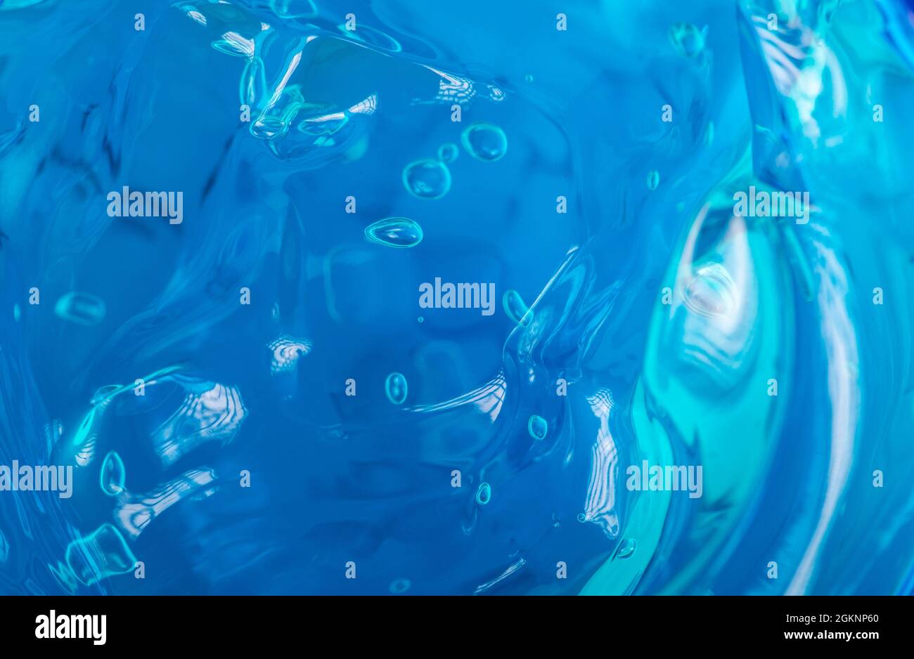 Blue liquid gel. Transparent skin care product Stock Photo - Alamy