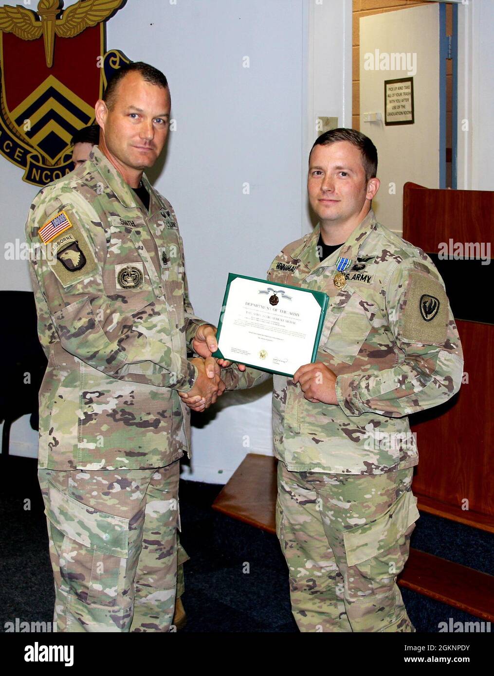 U.S. Army Staff Sgt. Allen Hennaman is presented the Army Achievement ...