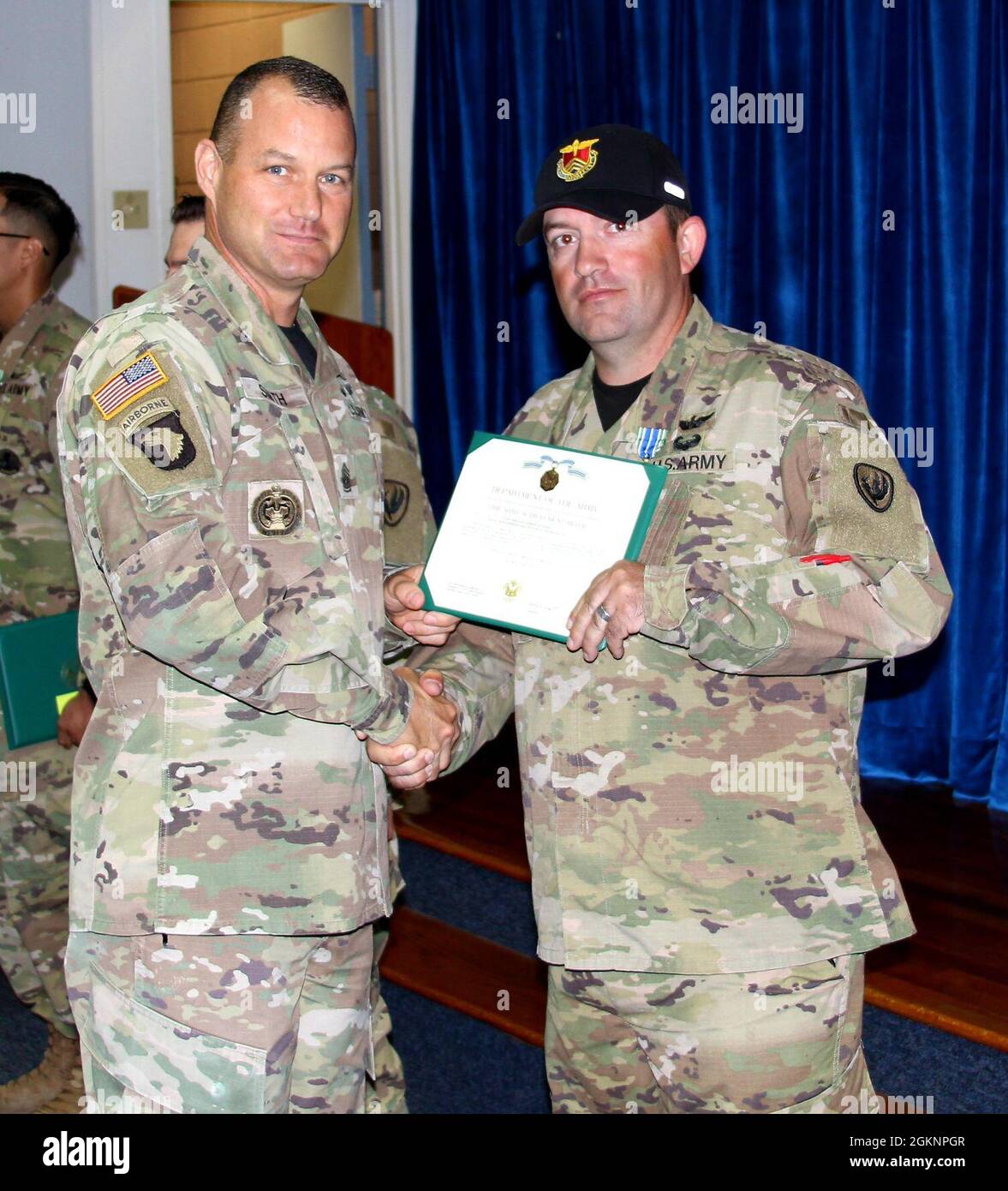 U.S. Army Staff Sgt. Jeremy Hines is presented an Army Achievement ...
