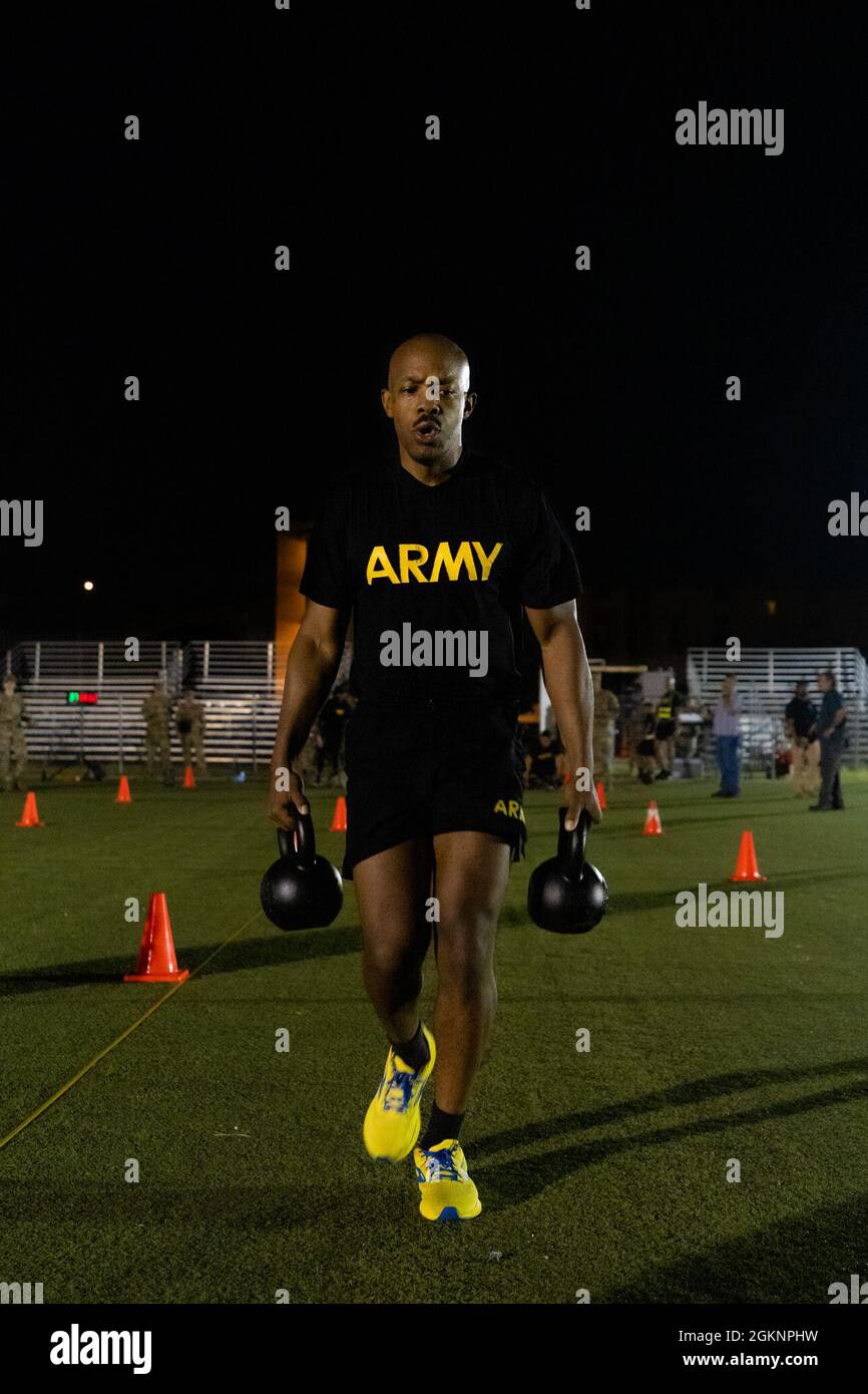 U.S. Army Staff Sgt. Corey Walton, assigned to U.S. Army North, carries ...