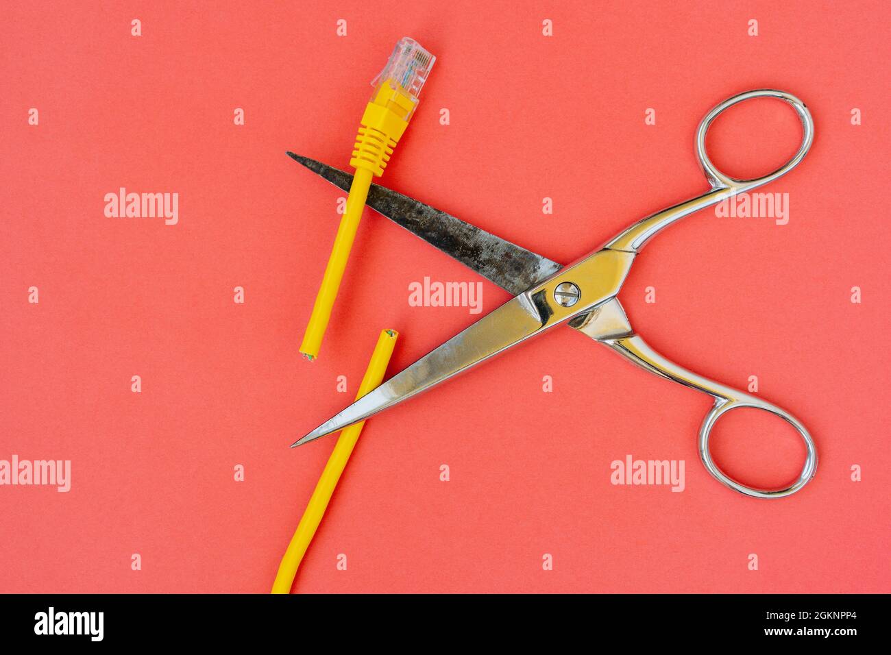Yellow internet cord cut by scissors. Concept of internet communication ...