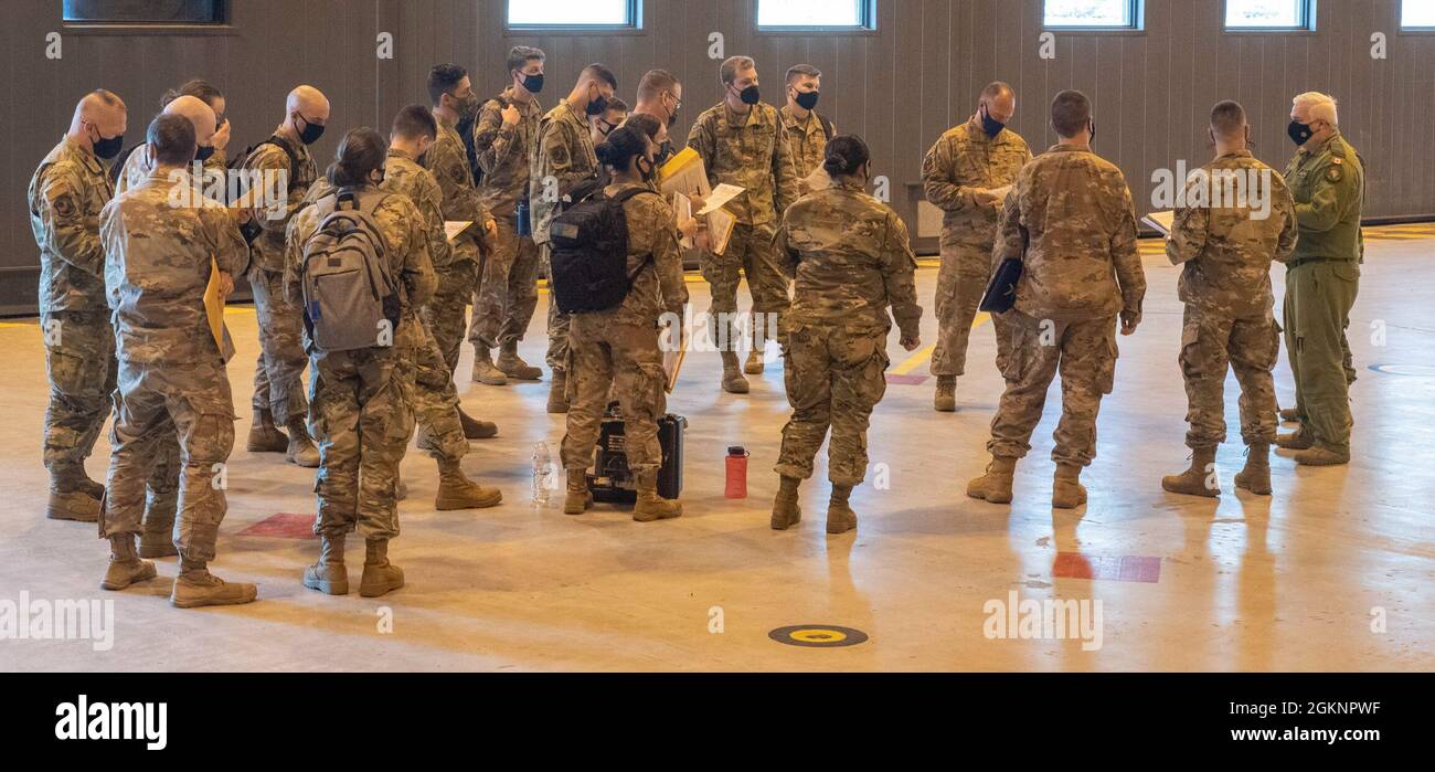 Royal Canadian Air Force Major MacDonald gives instructions to members ...