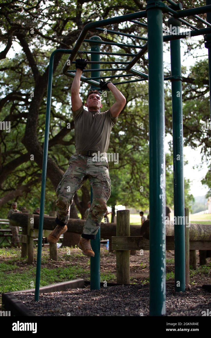 U.S. Army Spc. Justin Earnhart, assigned to U.S. Army South, swings ...