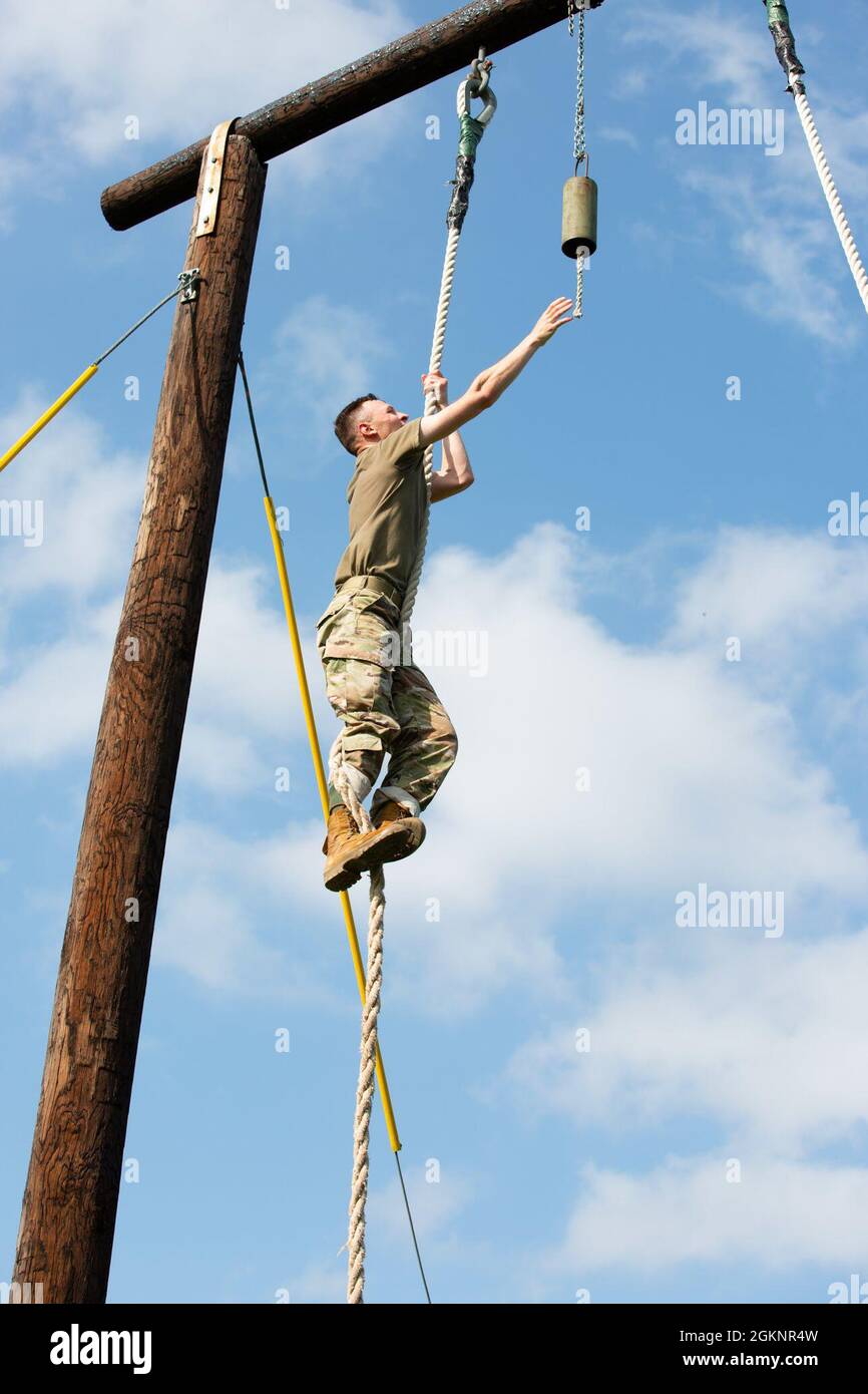 U.S. Army Spc. Mitchell Robinson, assigned to U.S. Army North, rings ...