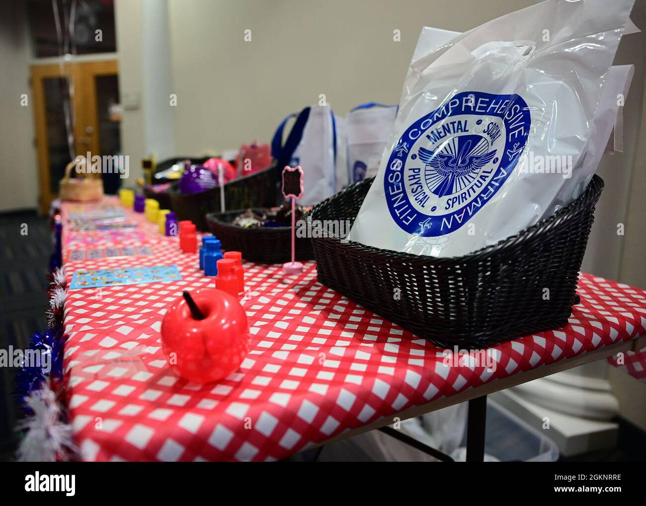 Tables are lined with gifts and information for families of deployed ...