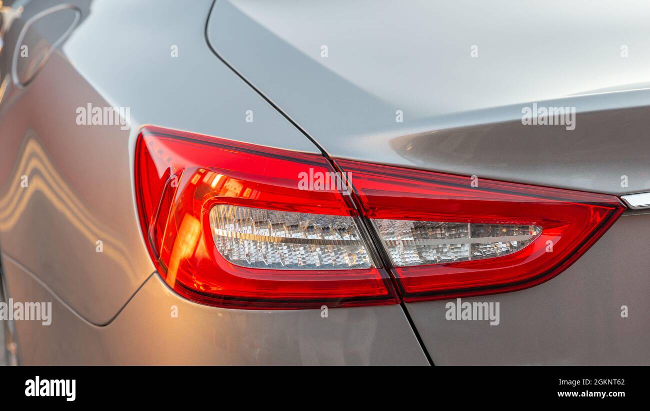 The red headlight of a modern sedan metallic car. Rear stop light ...