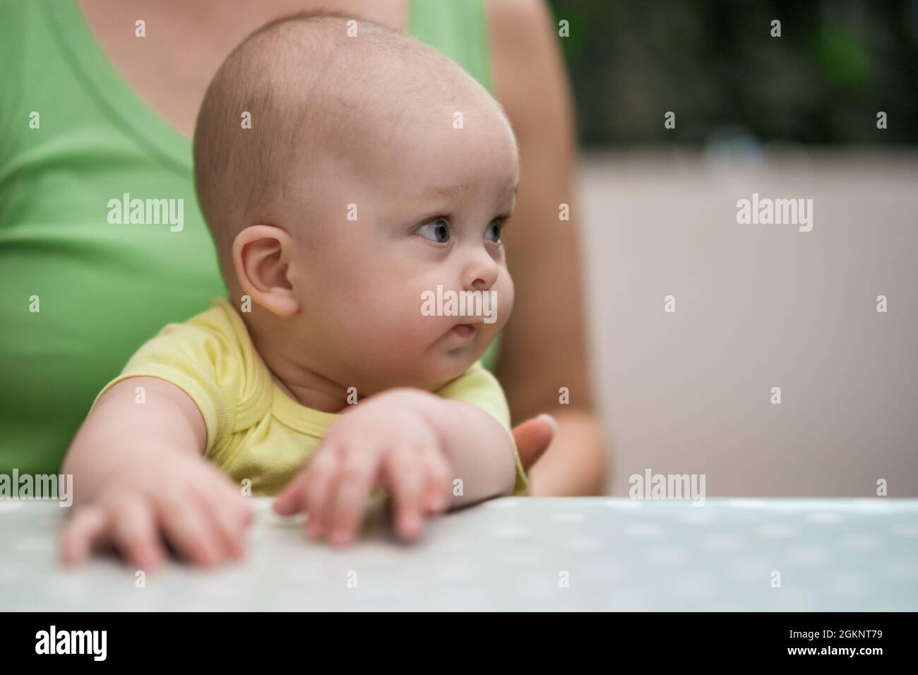 Sitting smiling bonding childhood new life holding cute hi-res stock ...