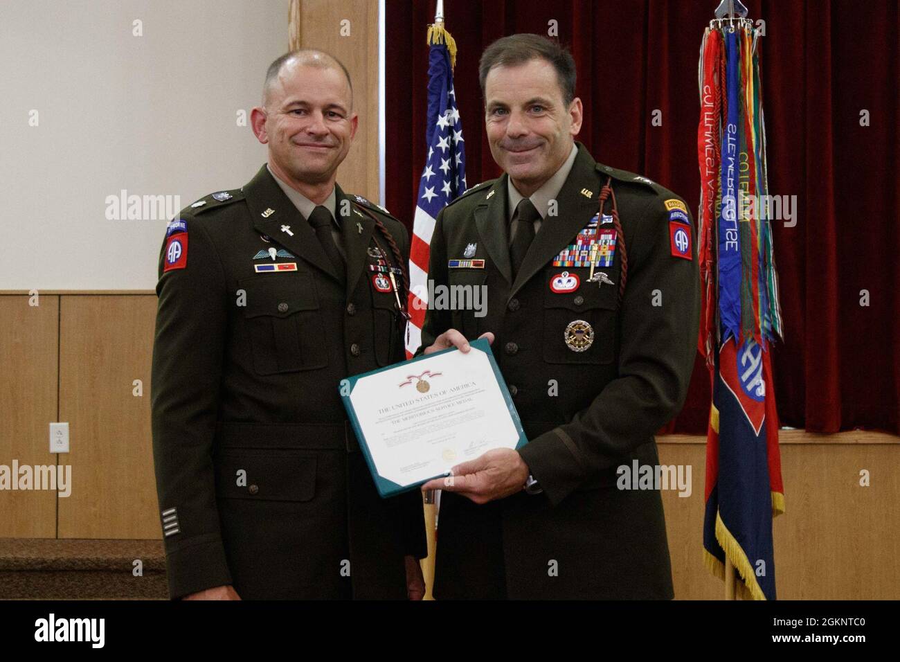Chaplain Lt. Col. Brian Koyn is recognized with an award for his ...