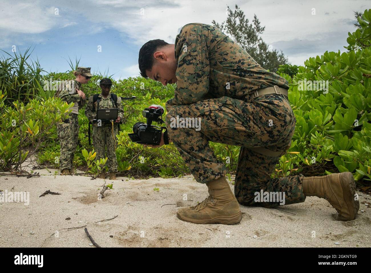 U.S. Marine Corps Cpl. Moises Rodriguez, right, combat videographer ...