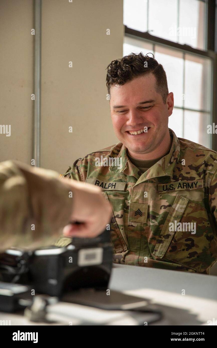 A Soldier prepares to enter fingerprint data into a biometrics scanner ...