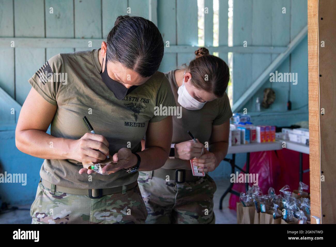 U.S. Army Staff Sgt. Jossary Hernandez, a healthcare sergeant, and Spc ...