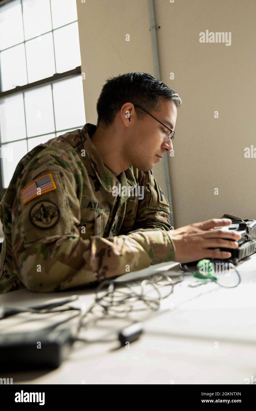 A Washington Army National Guard Soldier performs a function check on ...