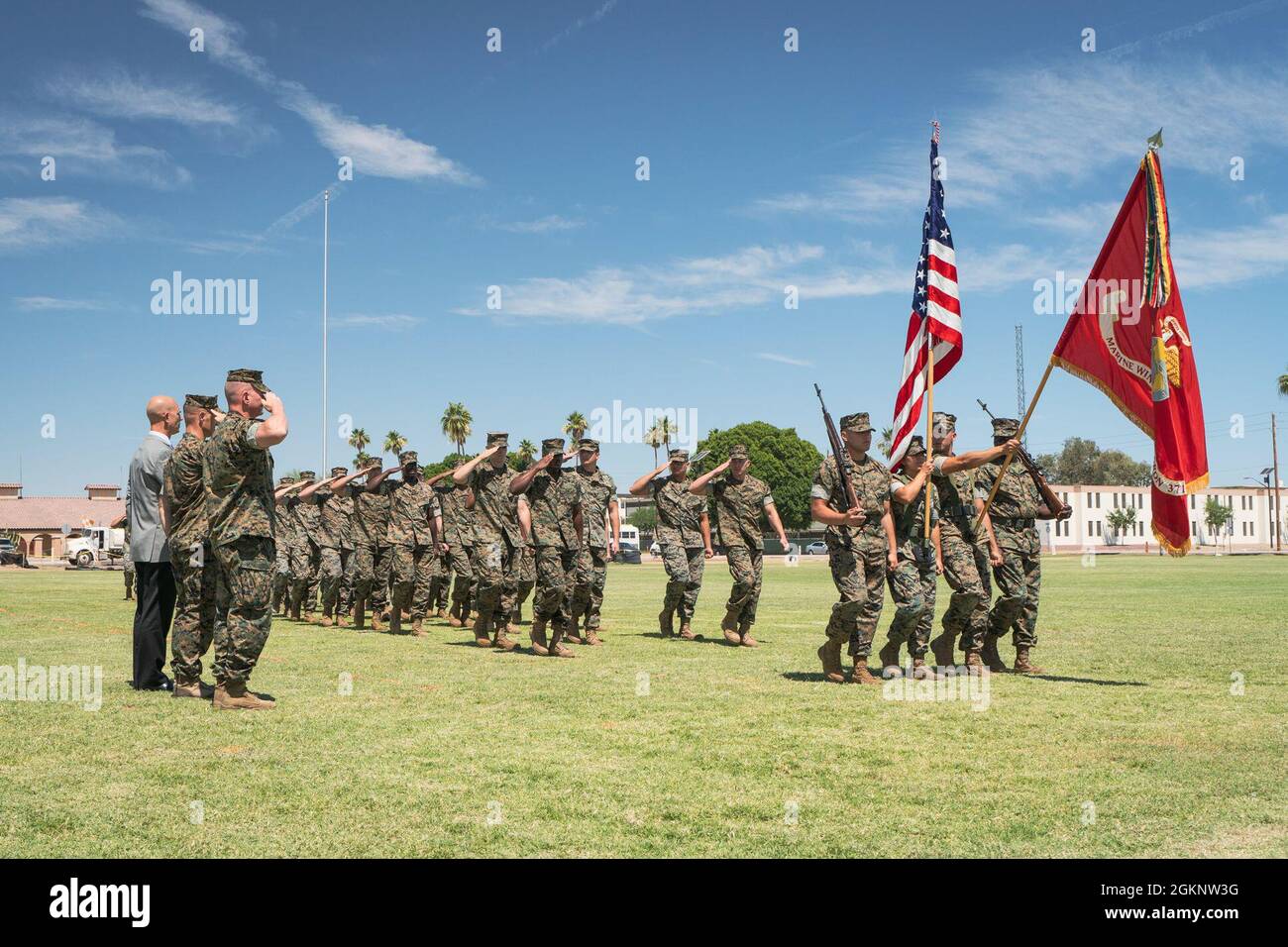 U.S. Marines from Marine Wing Support Squadron (MWSS) 371 salute U.S ...