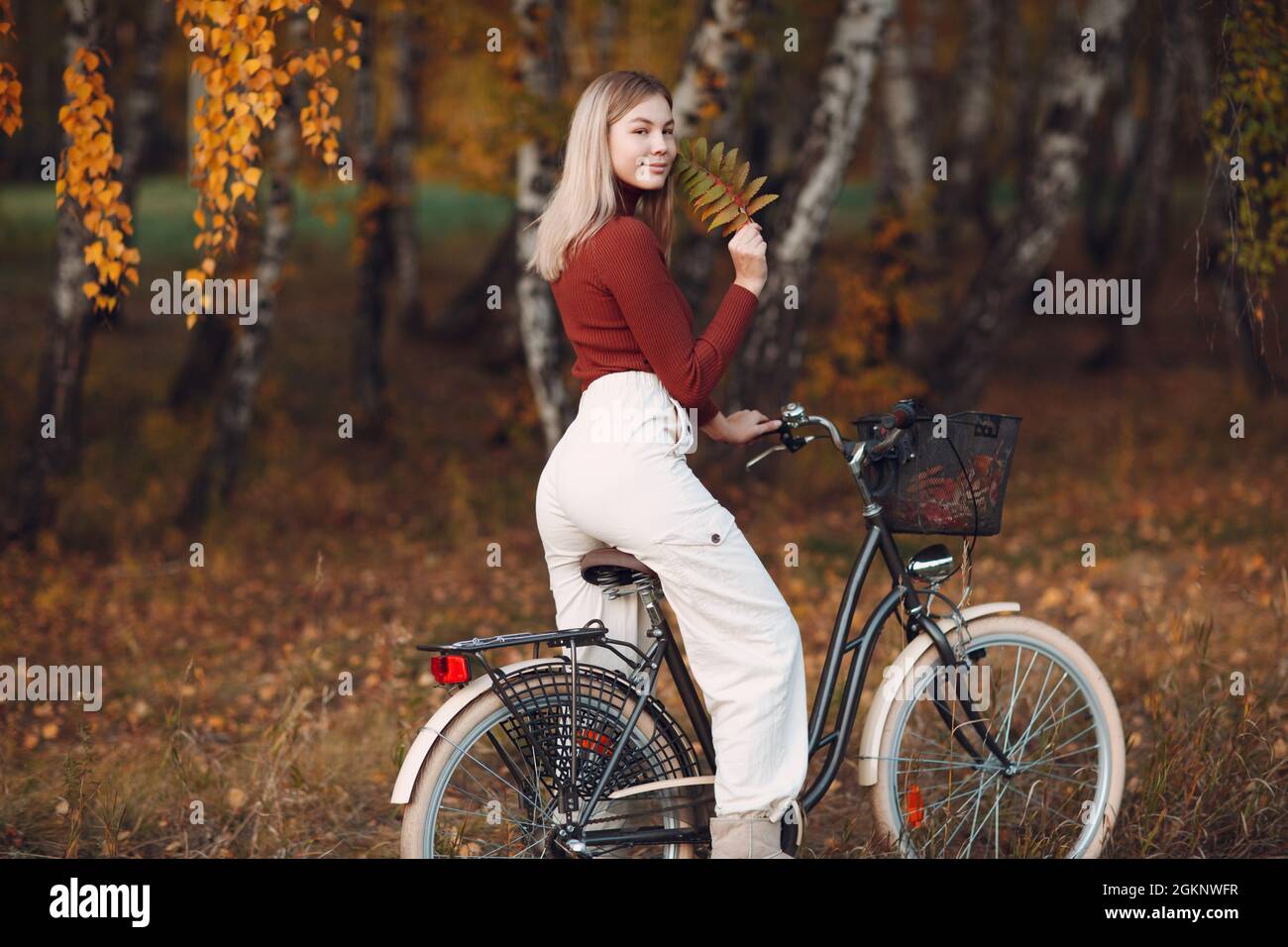 Happy active young woman ride bicycle in autumn park. Fall season Stock ...