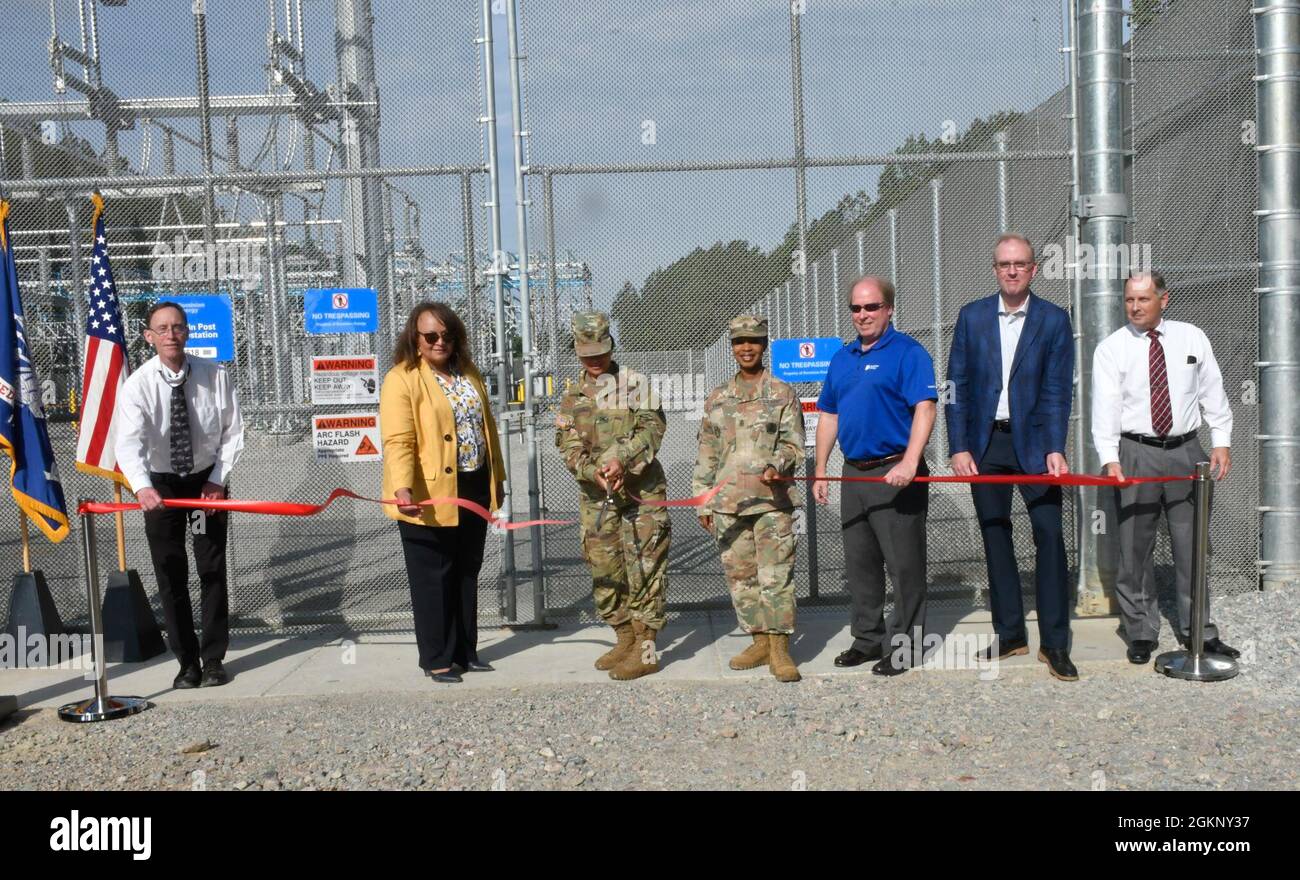Col. Karin Watson, garrison commander, cuts the ribbon to celebrate the ...