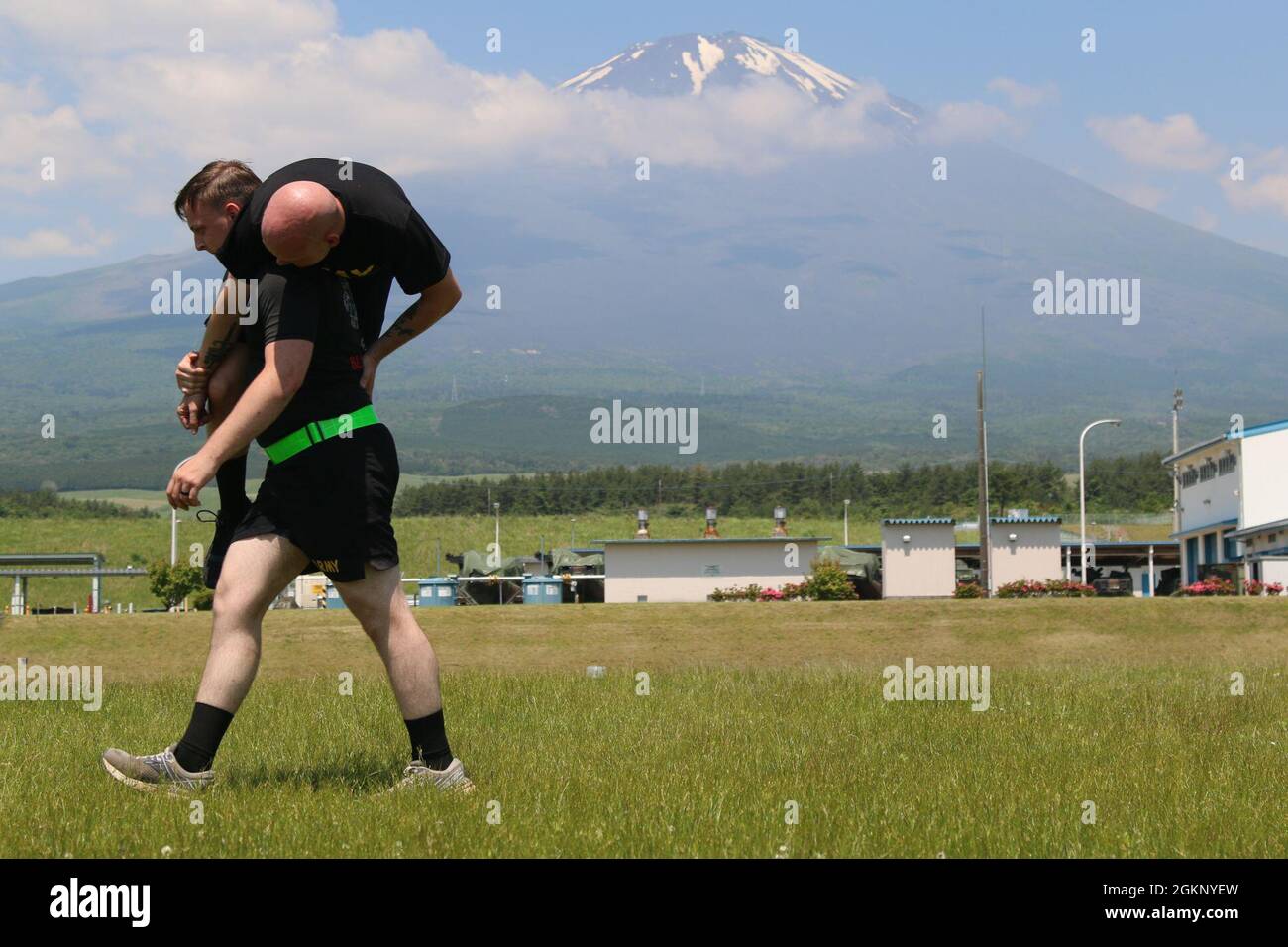U.S. Army Pfc. Charles Abell carries Pfc. John Zavala, both assigned to ...