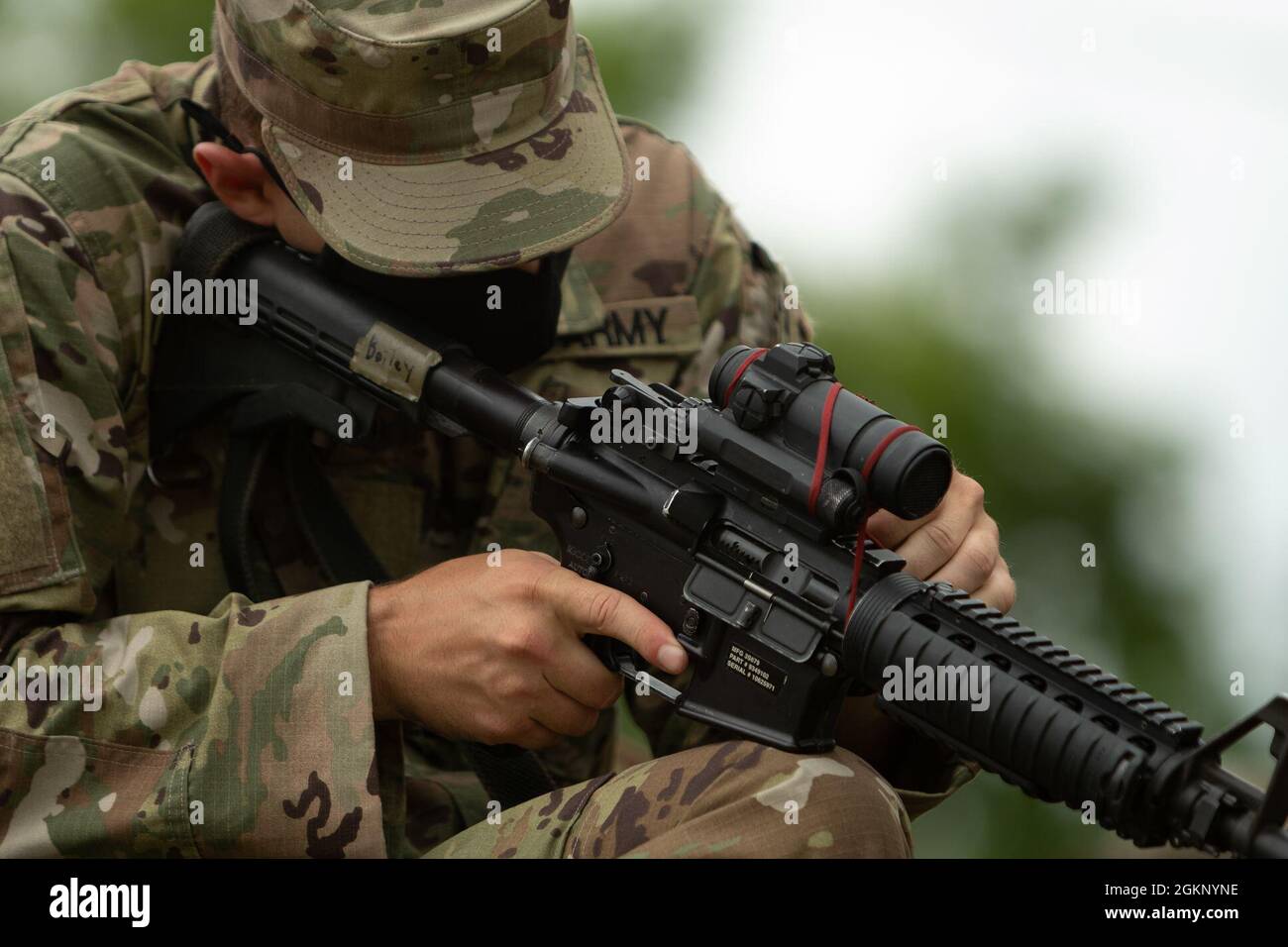 A Cadet makes an adjustment to his M4 Carbine during Cadet Summer ...