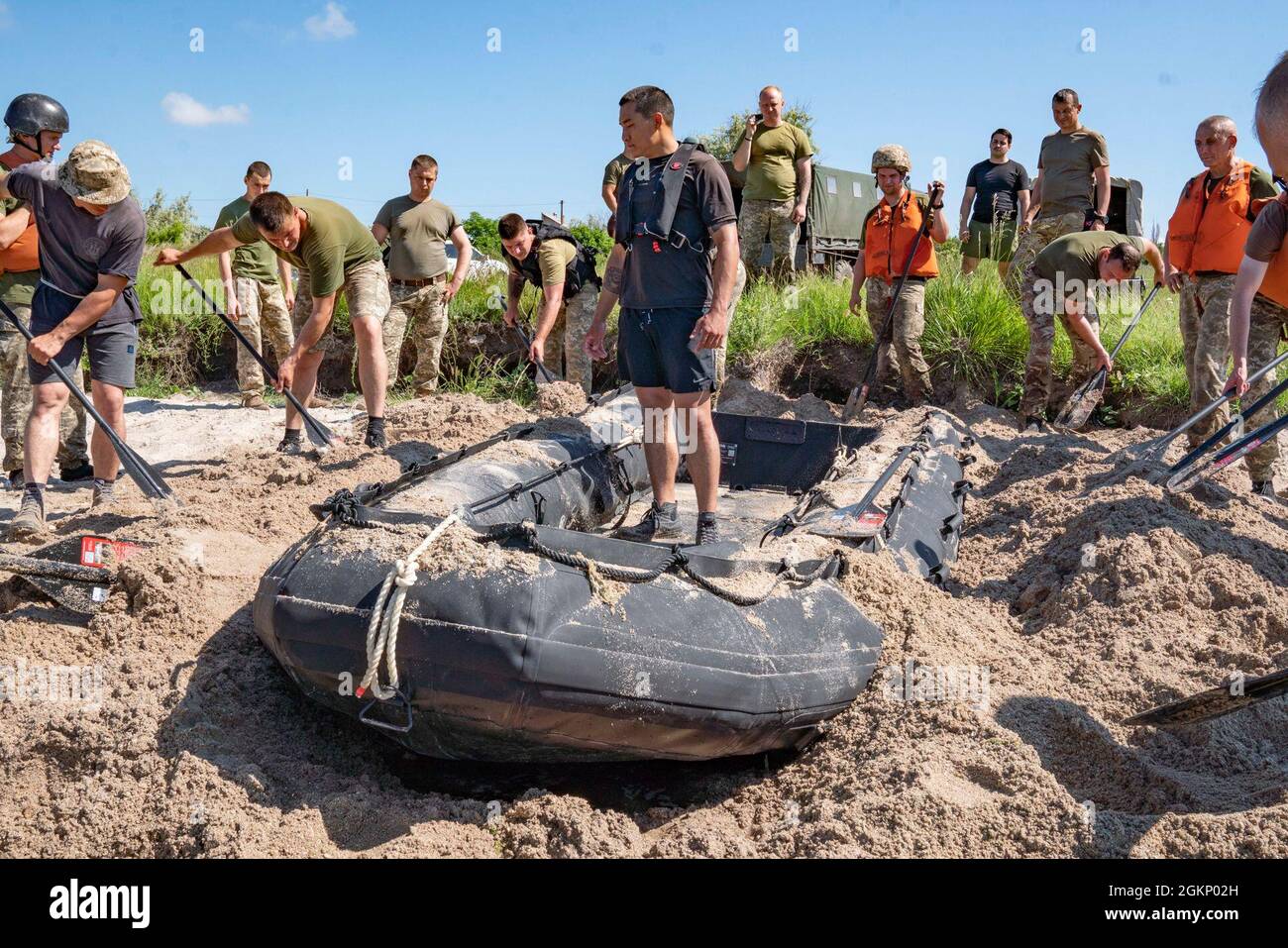 U.S. Marine Corps Staff Sgt. Tyler Ochs, center, an infantry unit ...